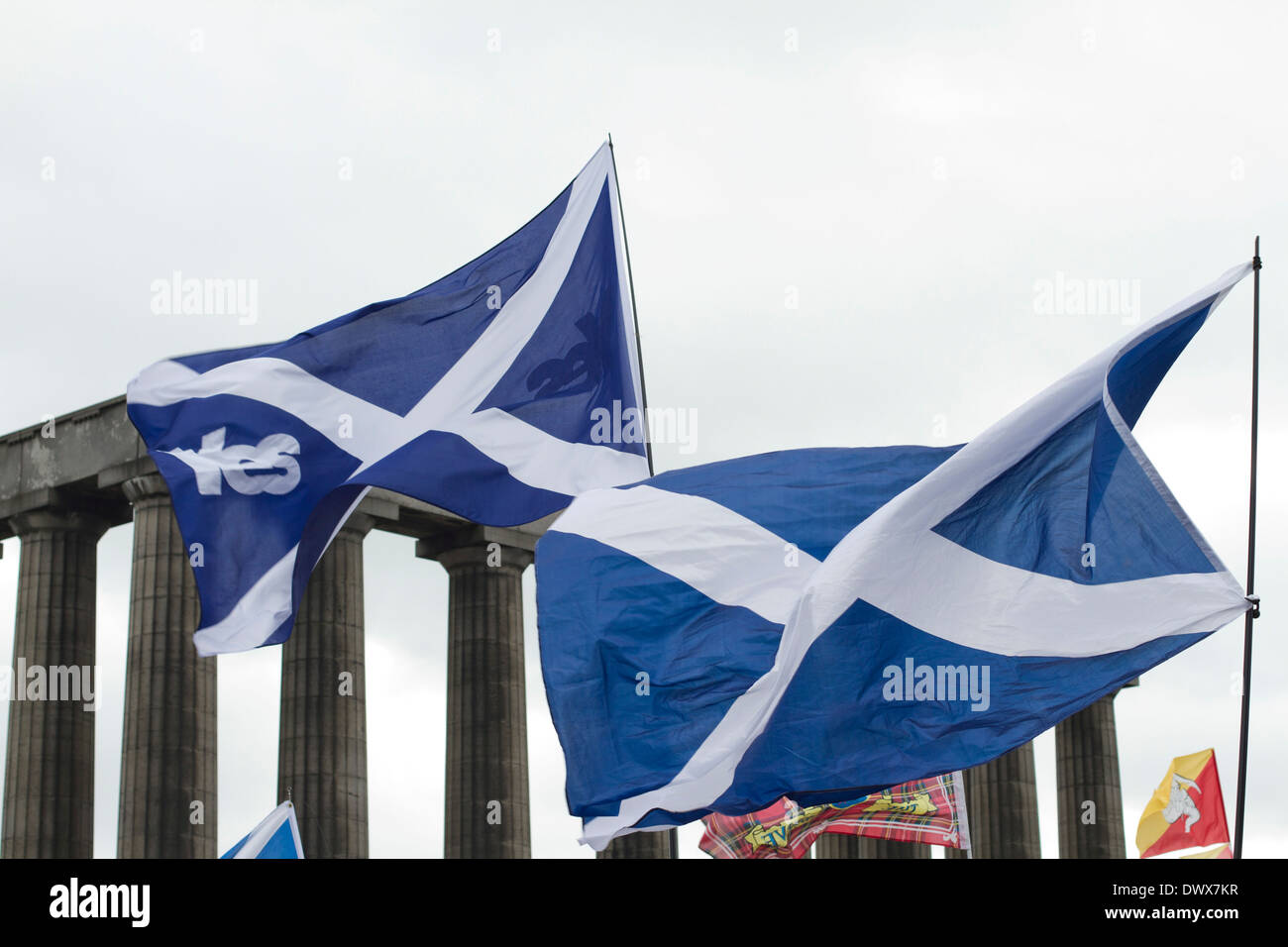 A Scottish saltire flag with the word 'Yes' is waved by crowds ...