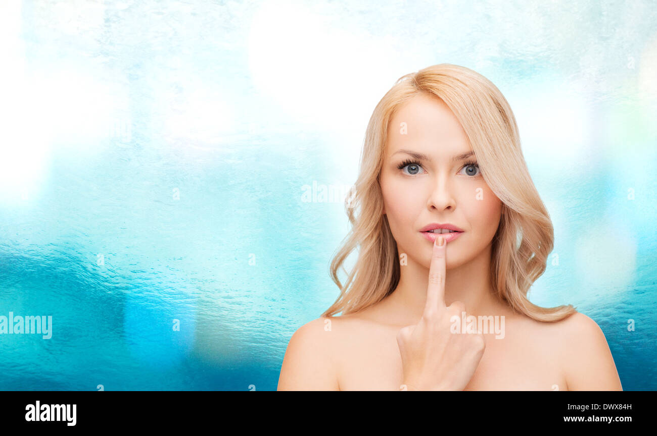 woman touching her lips Stock Photo - Alamy
