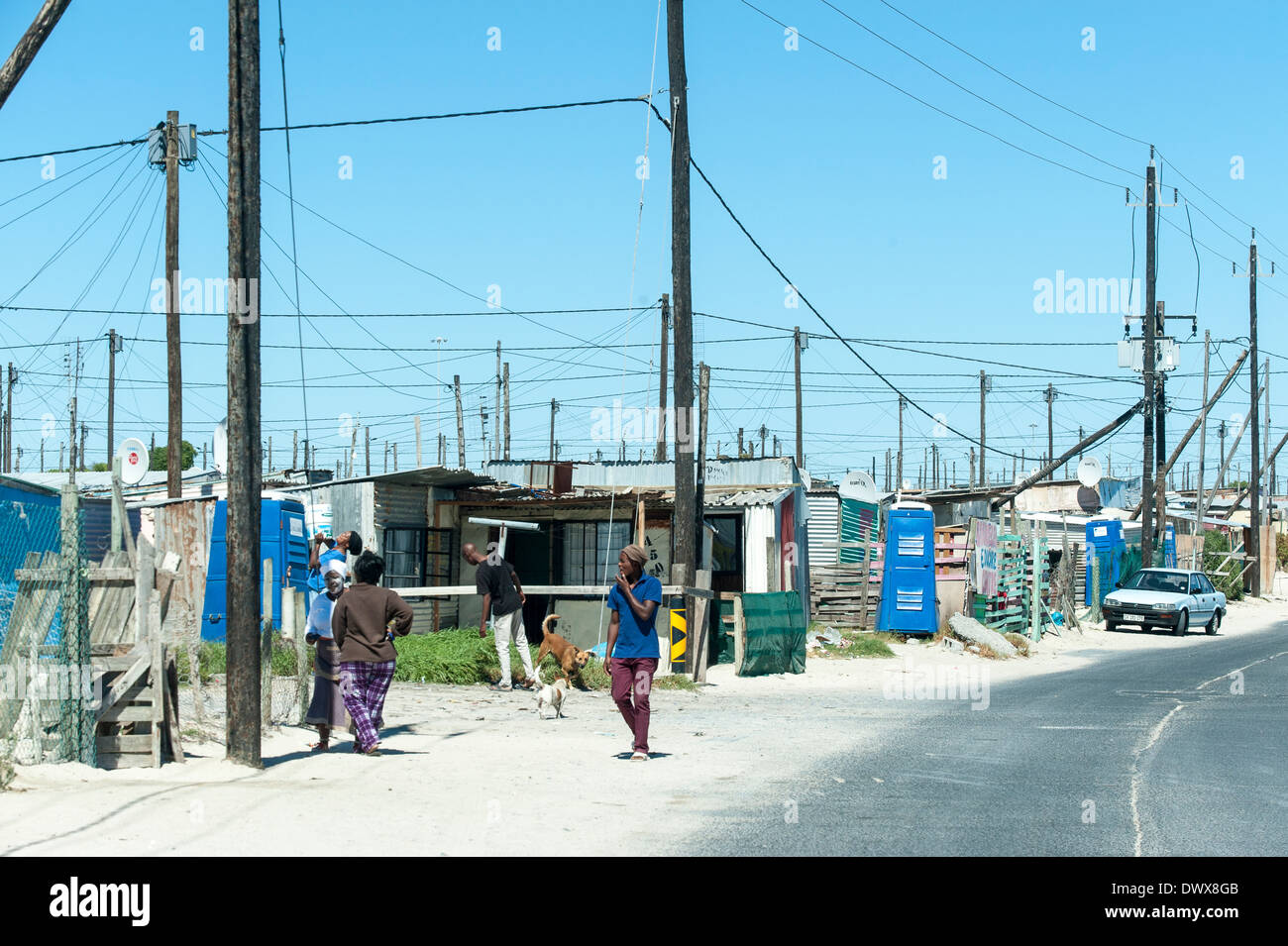 Road with makeshift houses and people in Khayelitsha, Cape Town ...