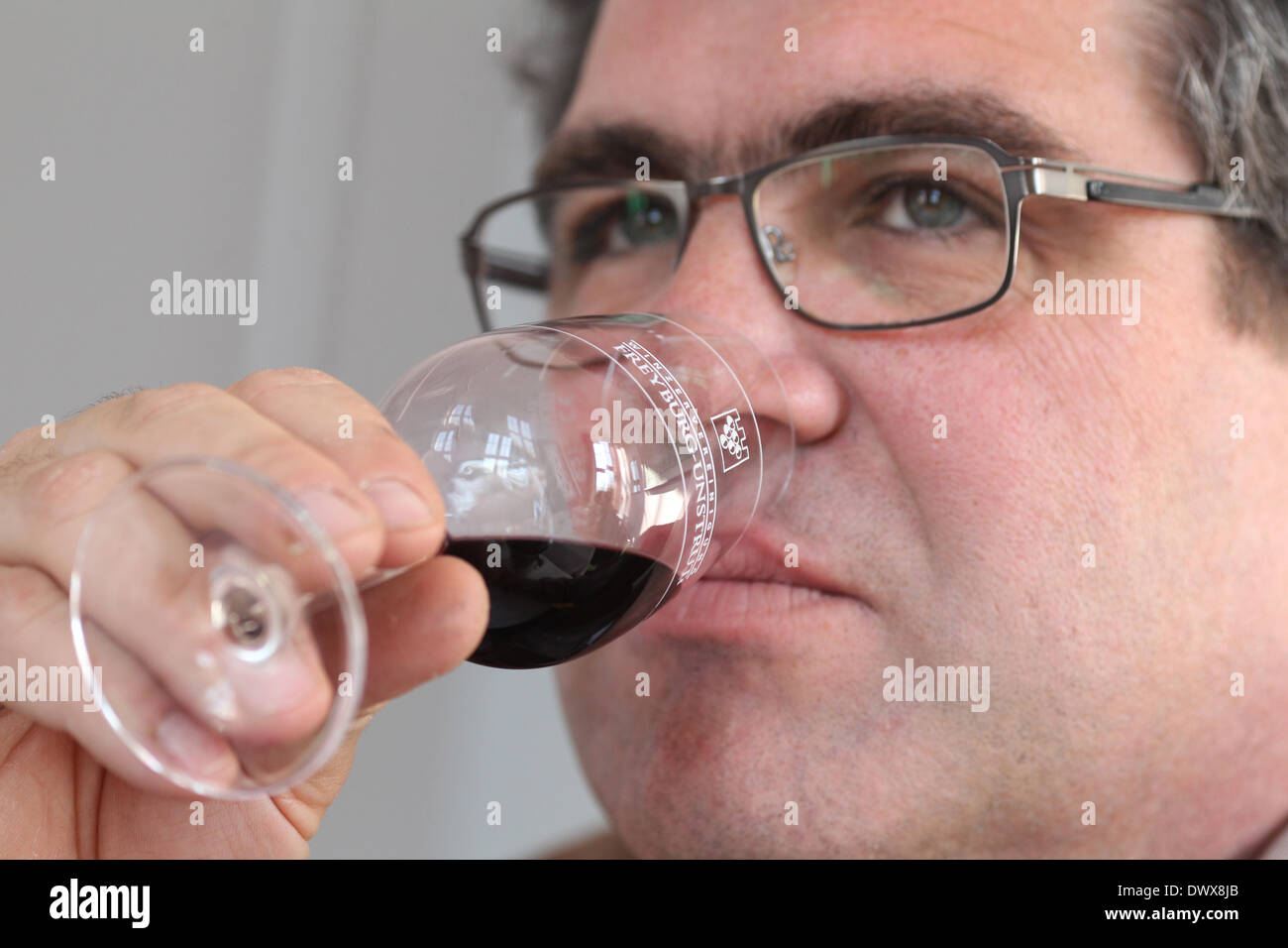 Freyburg, Germany. 13th Mar, 2014. Winemaker Stephan Herzer tastes a ...