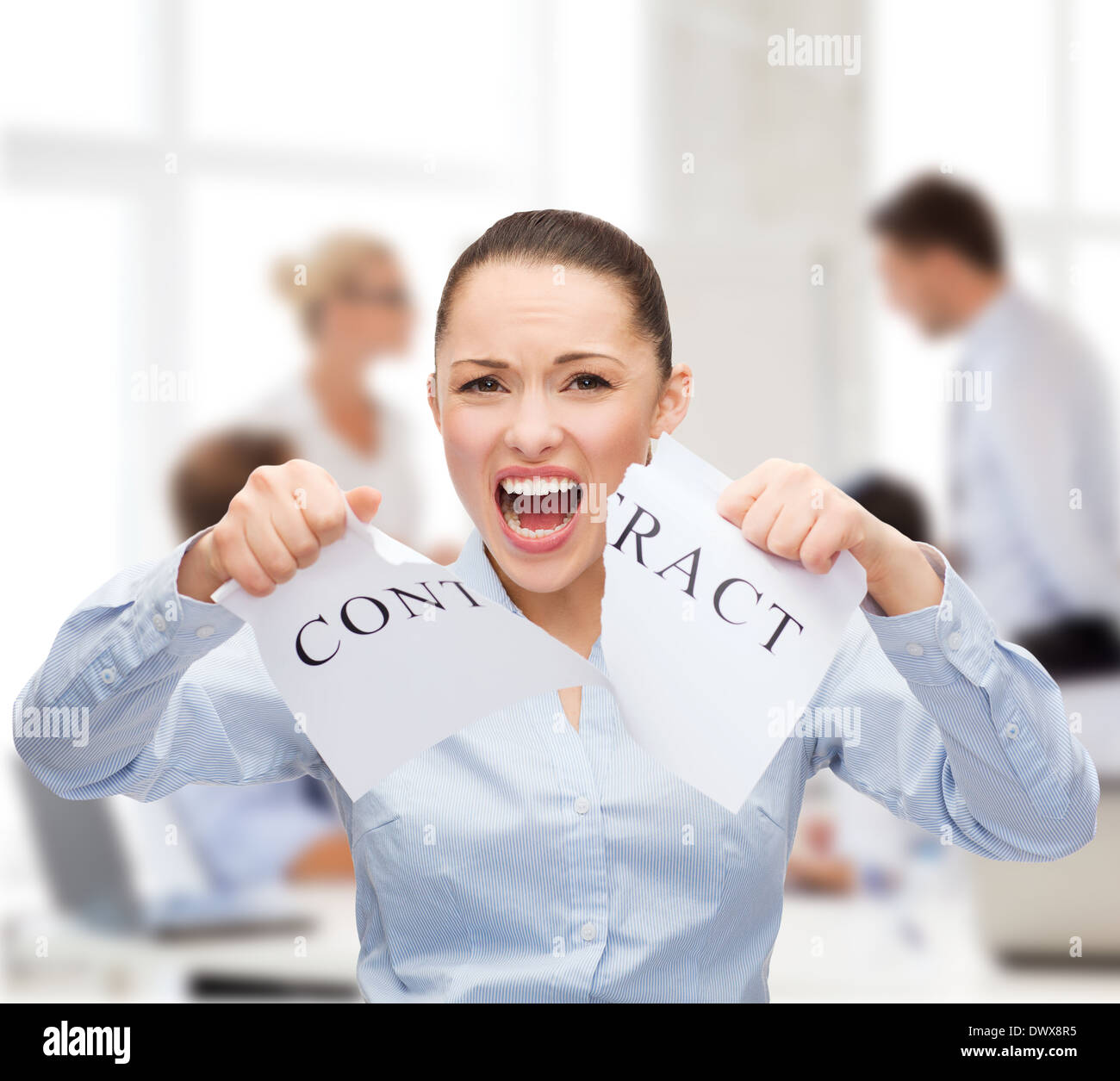 serious businesswoman tearing contract Stock Photo - Alamy