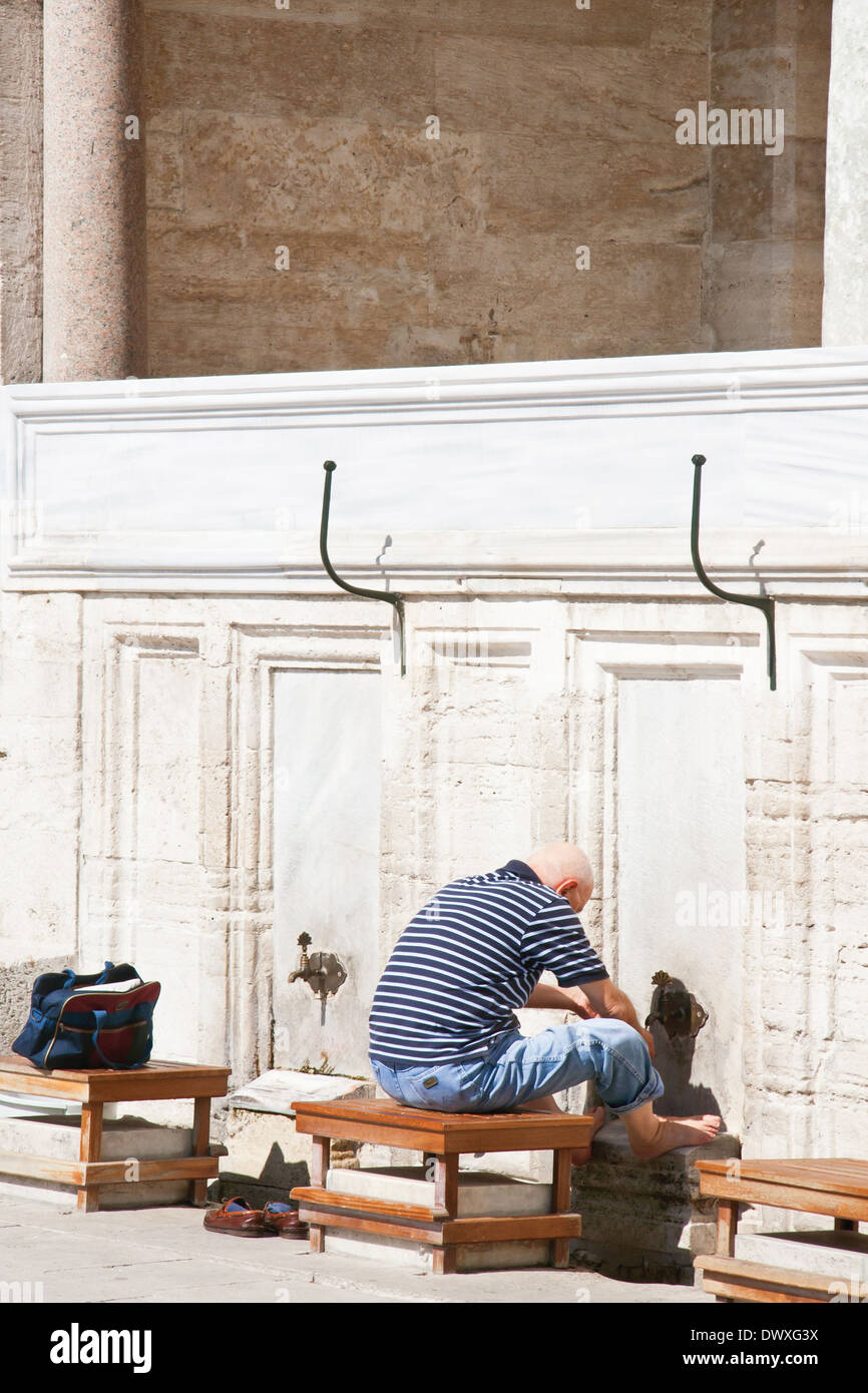 Muslim taking ablutions hi-res stock photography and images - Alamy