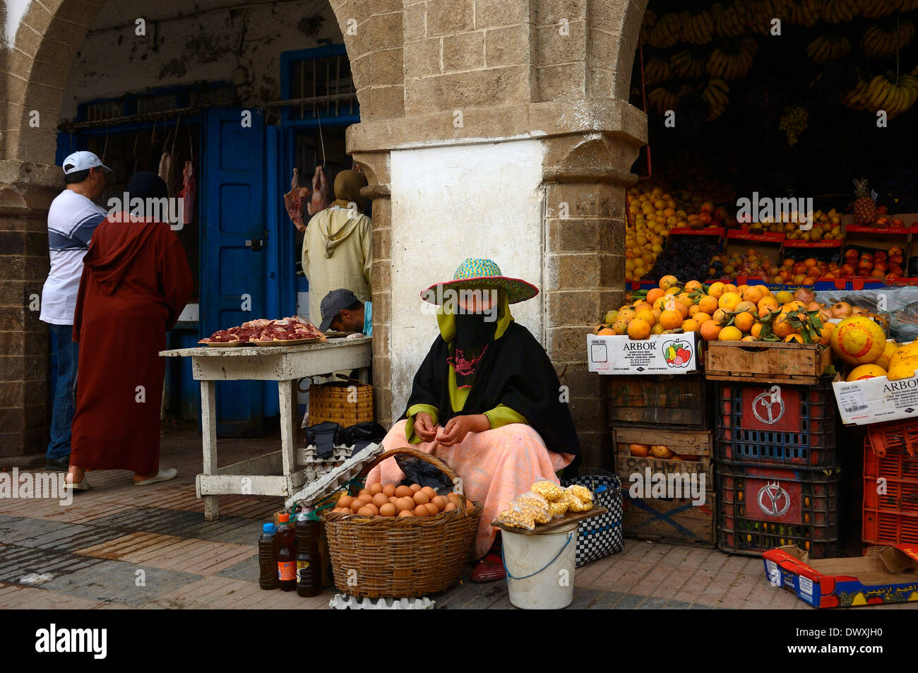 Female shopkeeper sitting outside her stall. Essaouira. Morocco Stock ...