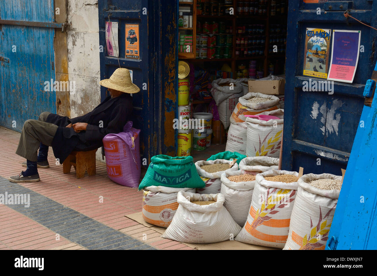 Shopkeeper sitting outside his shop. Essaouira. Morocco Stock Photo - Alamy