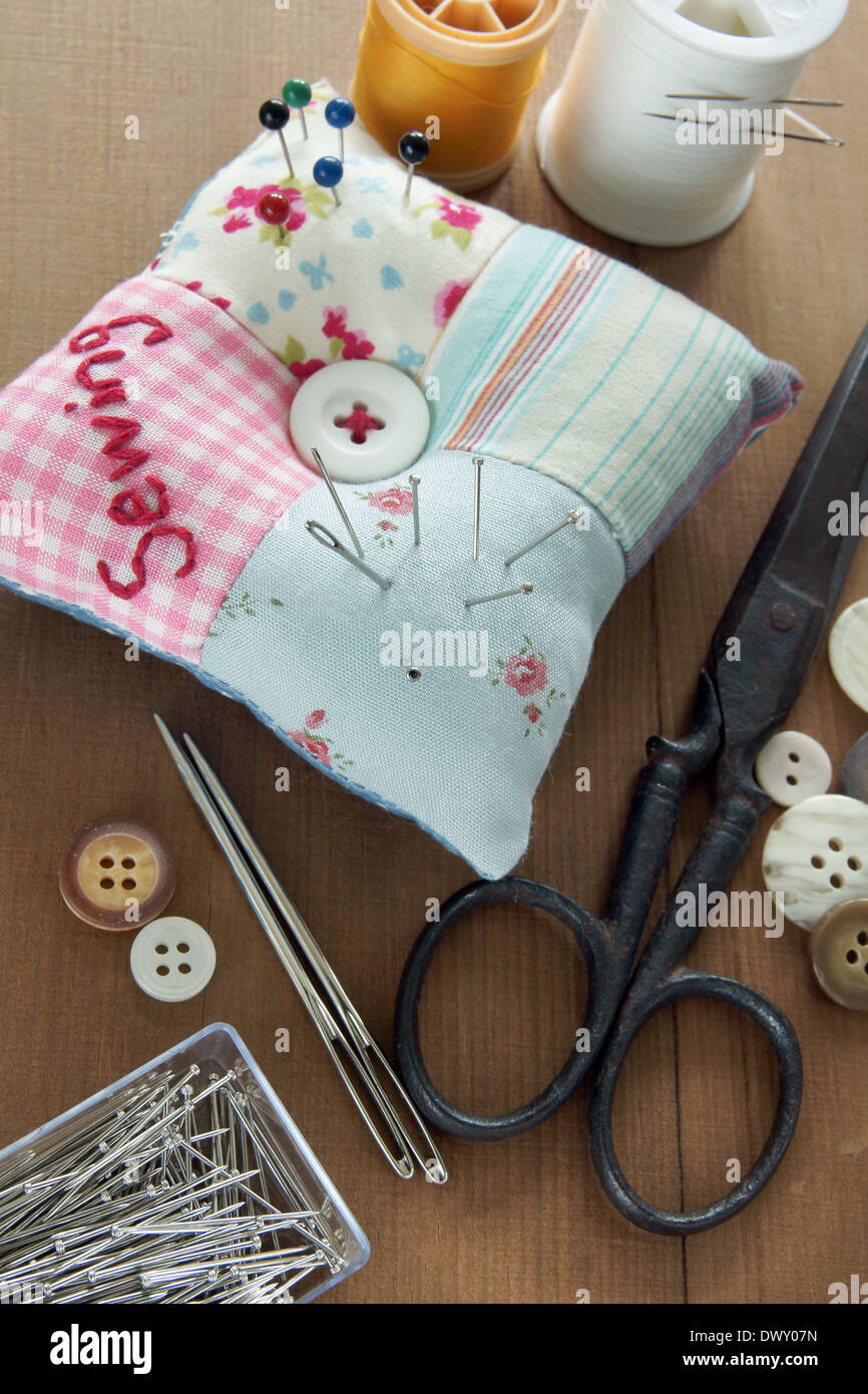 Sewing items with a vintage feel, thread, antique scissors, pins and ...