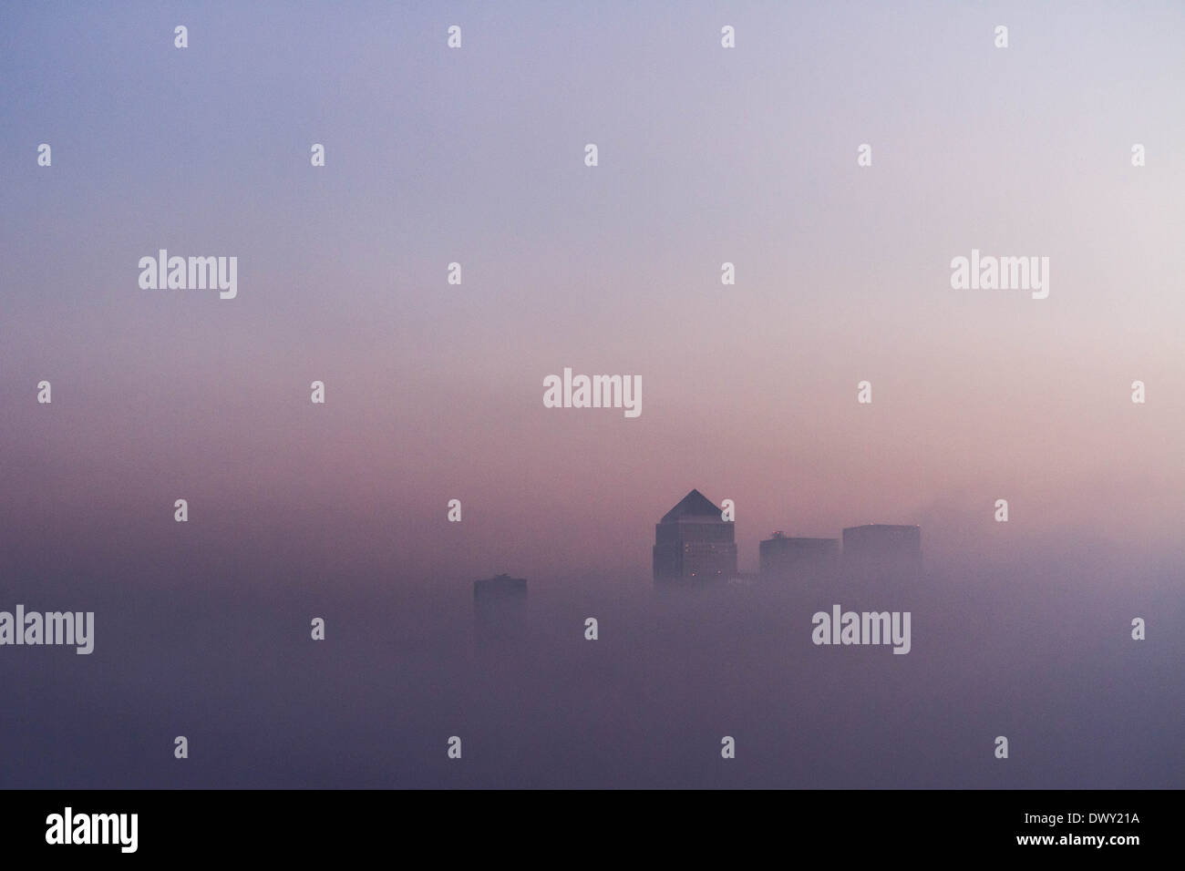 London's Canary Wharf buildings seen just visible through the heavy ...