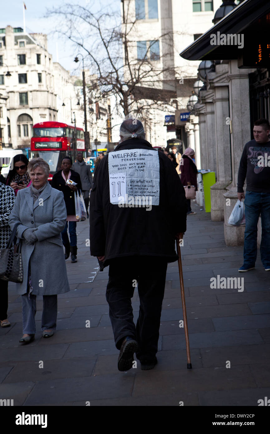 An elderly man looking for work on the streets of London Stock Photo ...