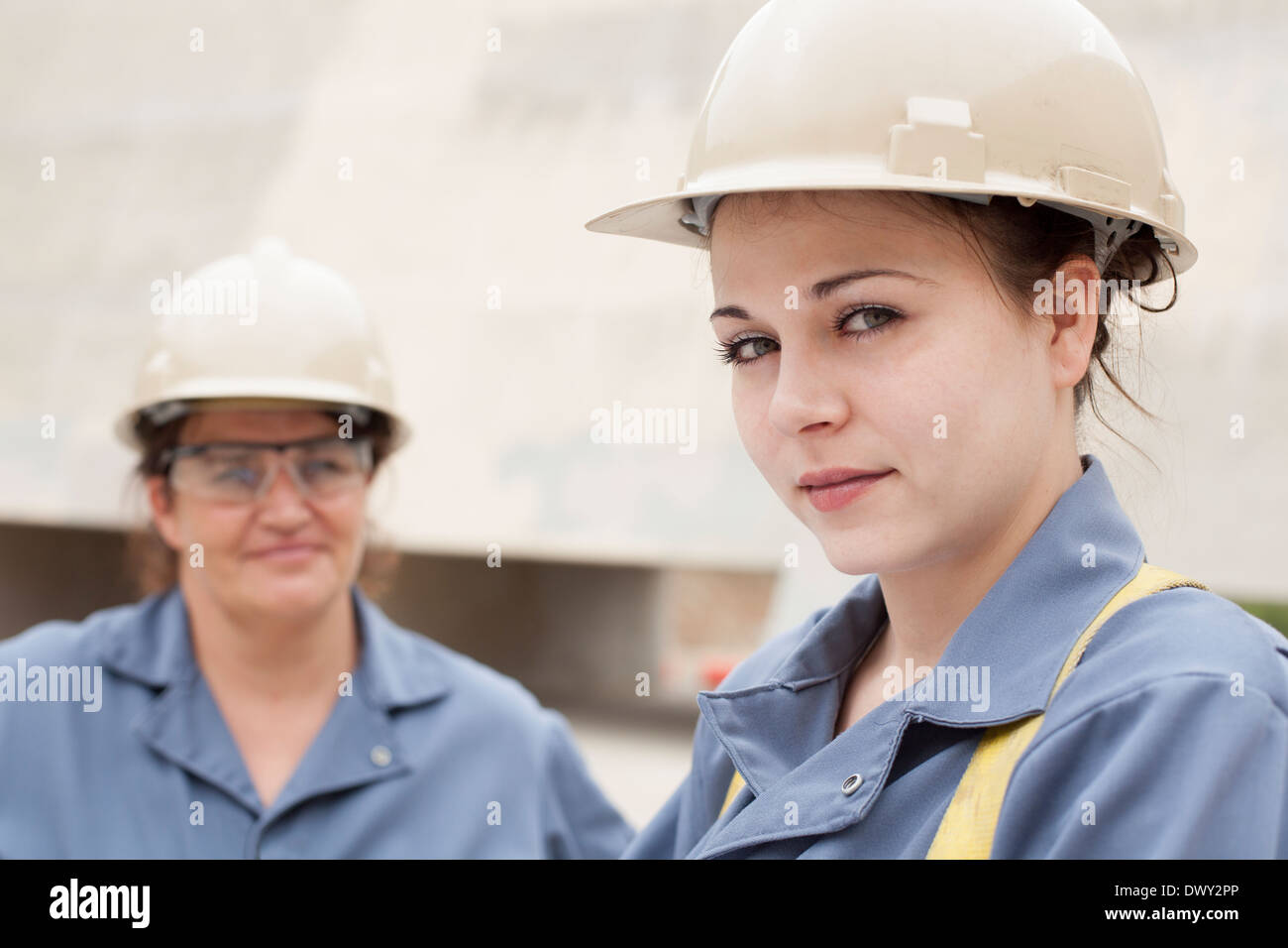Female constructors on construction site Stock Photo - Alamy