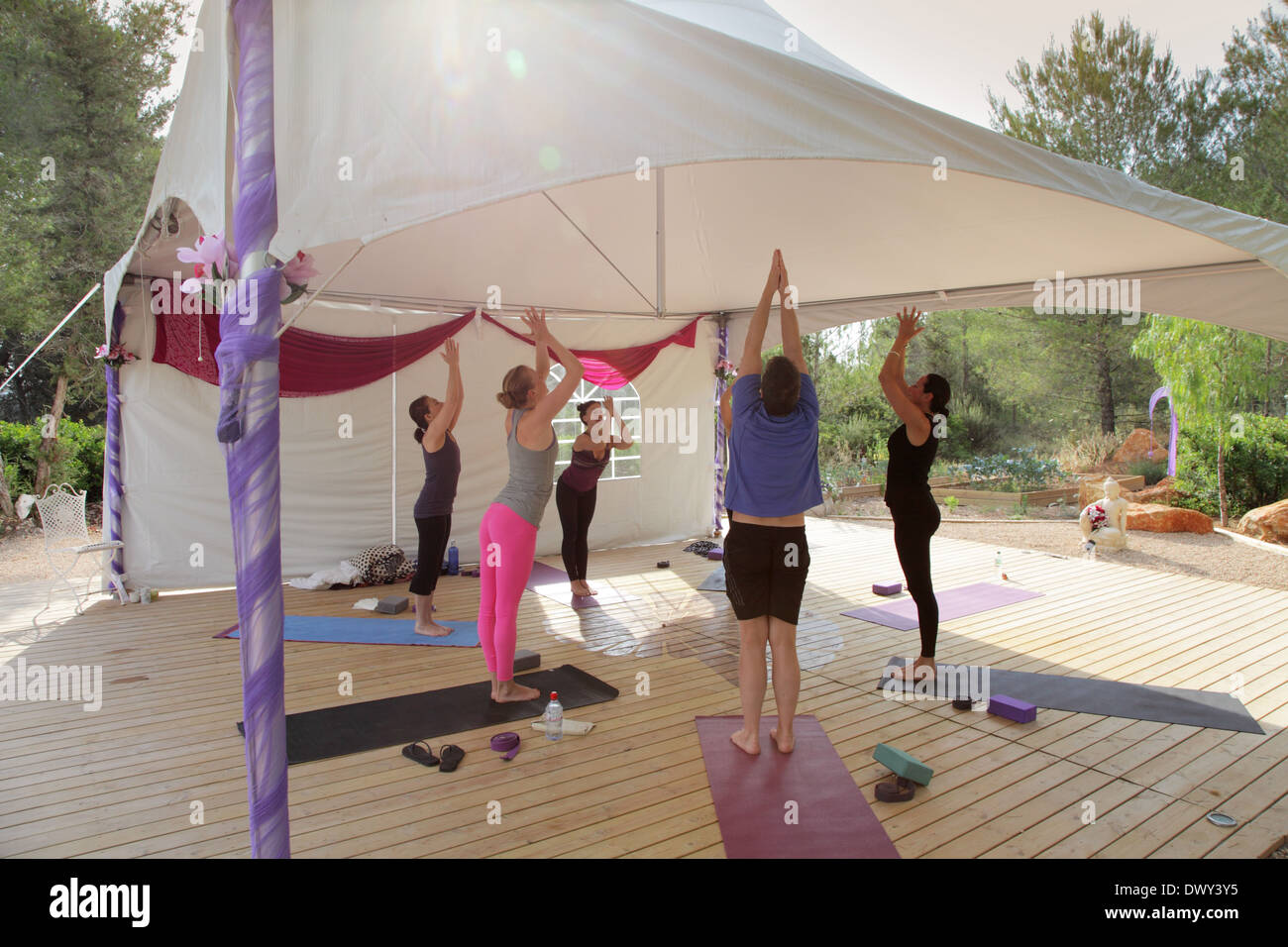 Yoga practice in circle Stock Photo - Alamy