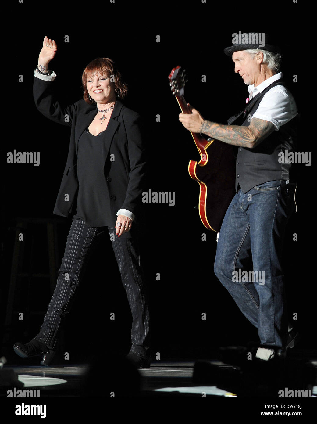 Pat Benatar and Neil Giraldo performing live at the 1-800-Ask-Gary ...