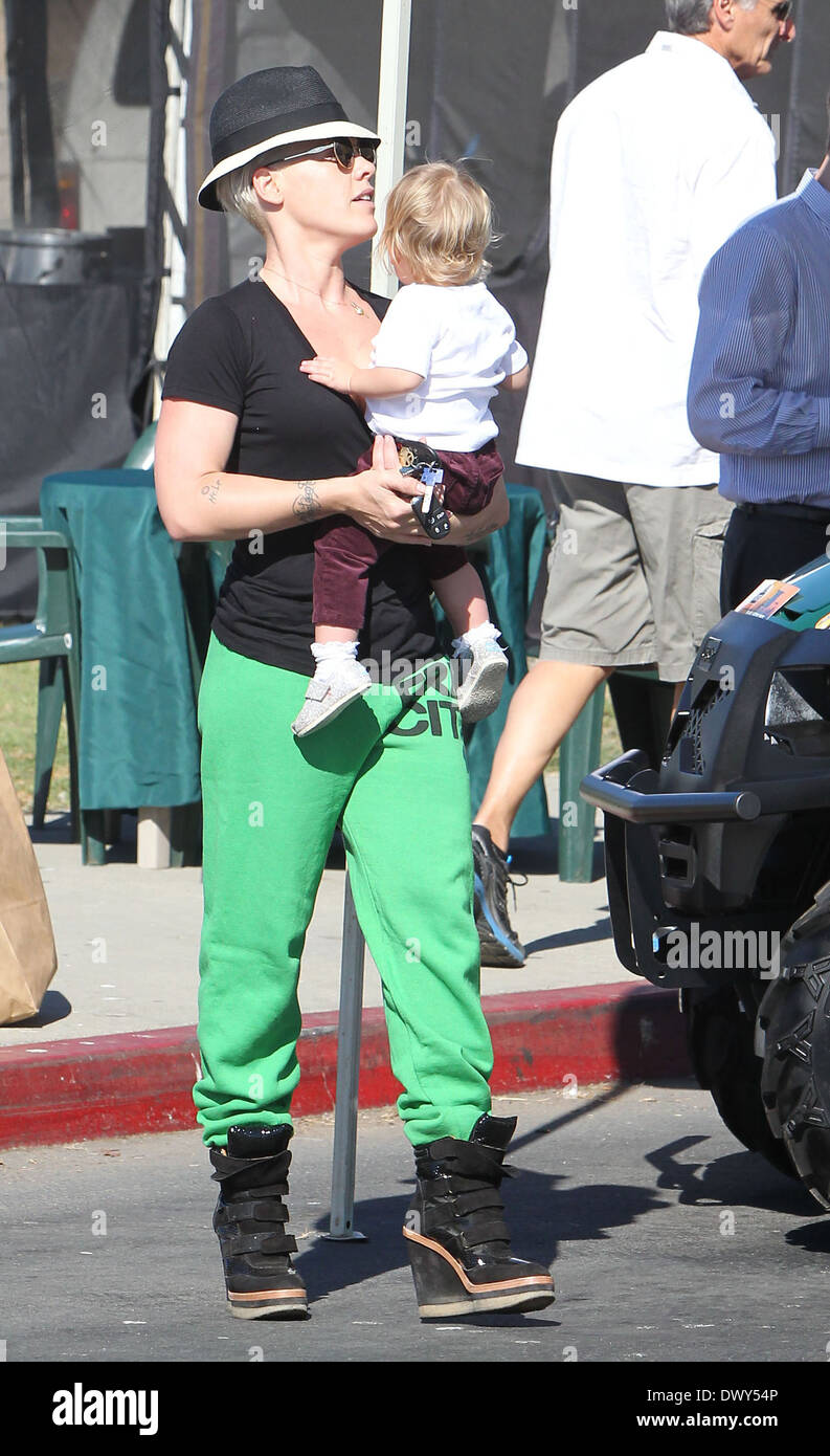 Pink real name Alecia Moore, carries her daughter Willow in her arms ...