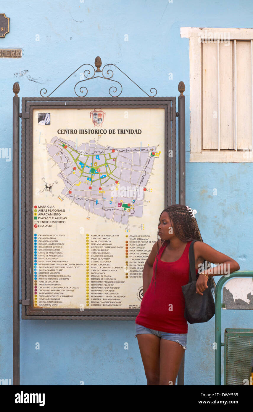 Daily life in Cuba - young woman with dreadlocks standing near centre ...