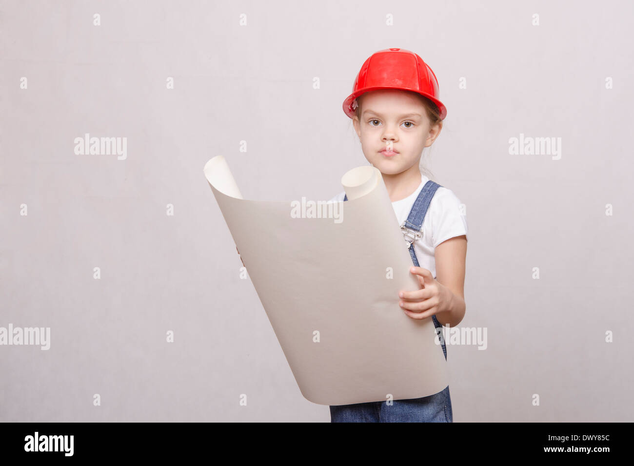 Girl playing Builder launched the drawing up and looks into the drawing ...
