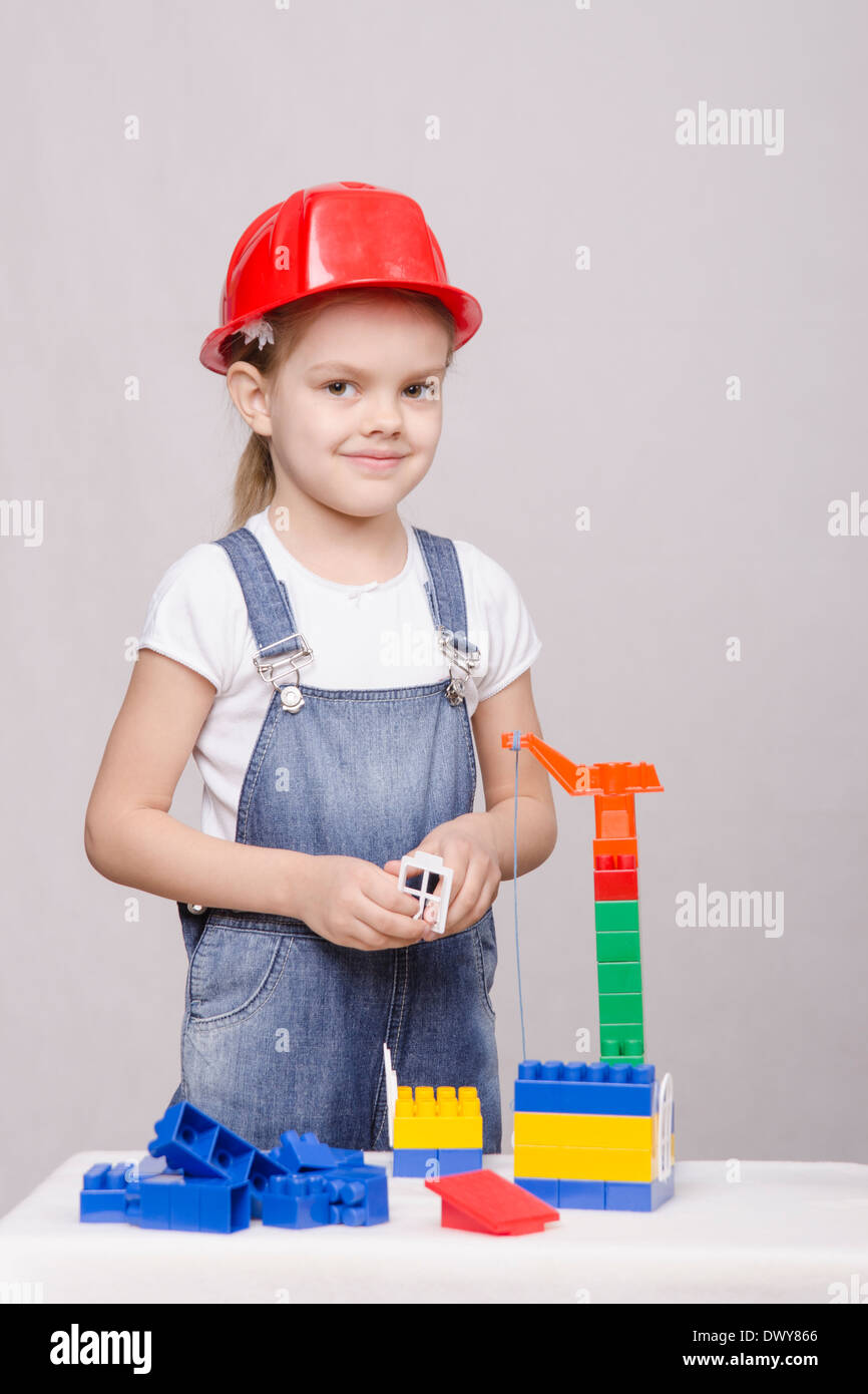 Girl playing in the Builder builds from the designer house Stock Photo ...