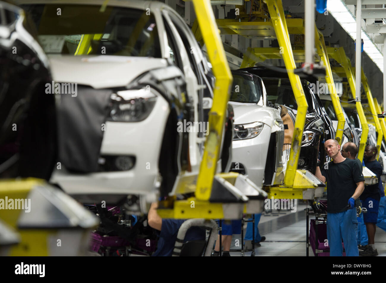 Regensburg, Germany. 13th Mar, 2014. Workers assemble car parts in the ...