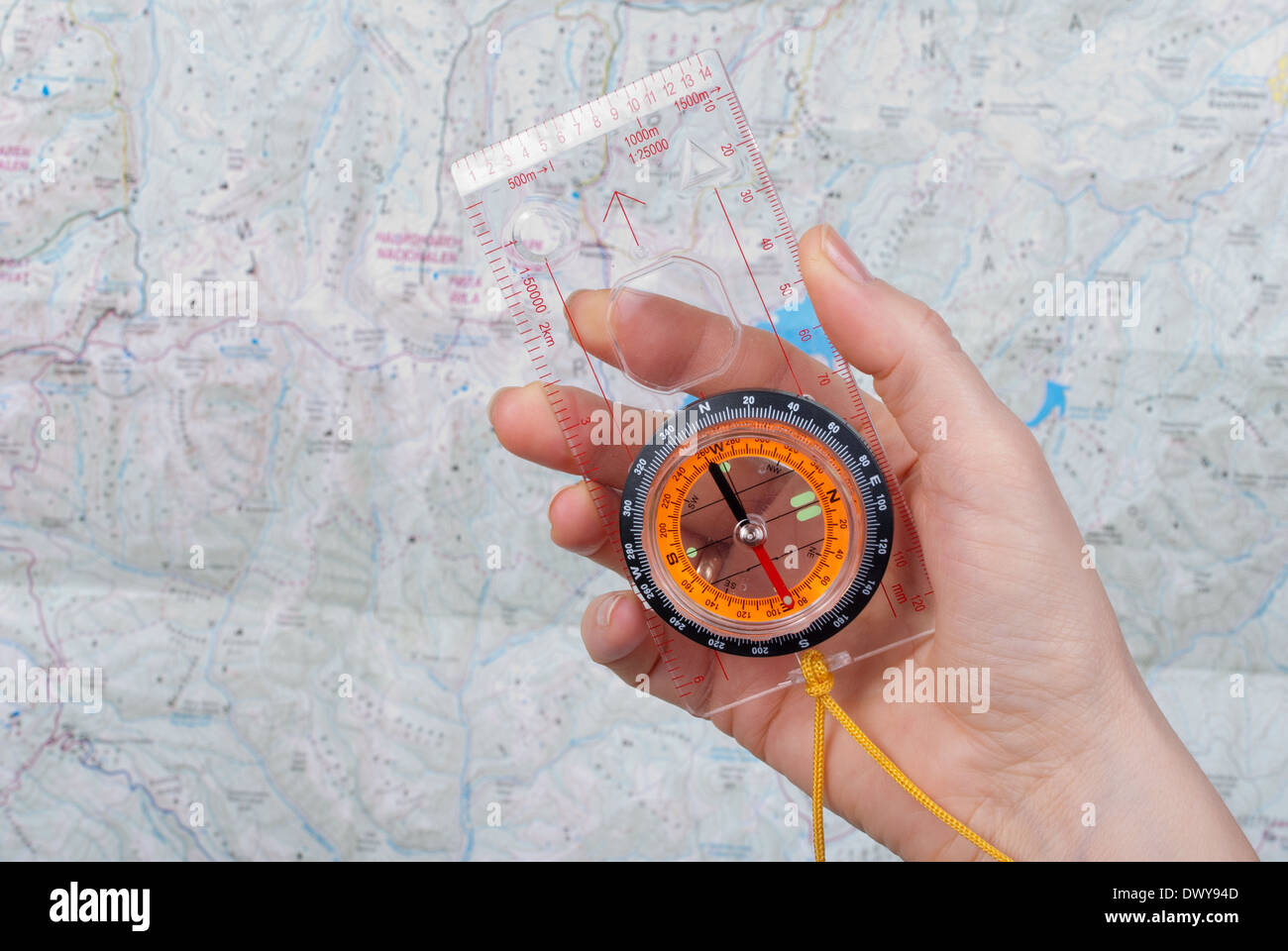 compas, map and hand Stock Photo - Alamy