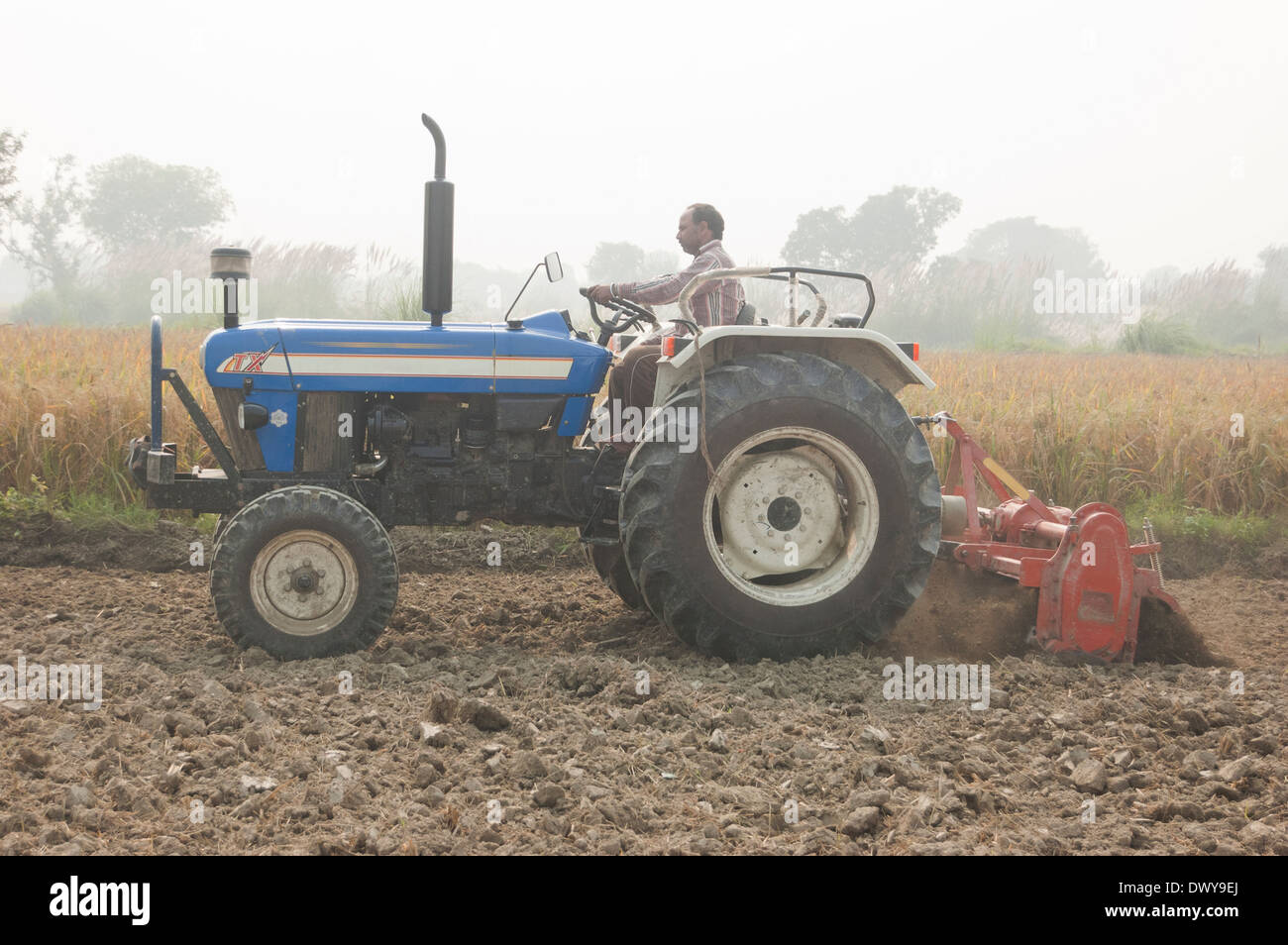 Side view of tractor with plough hi-res stock photography and images ...