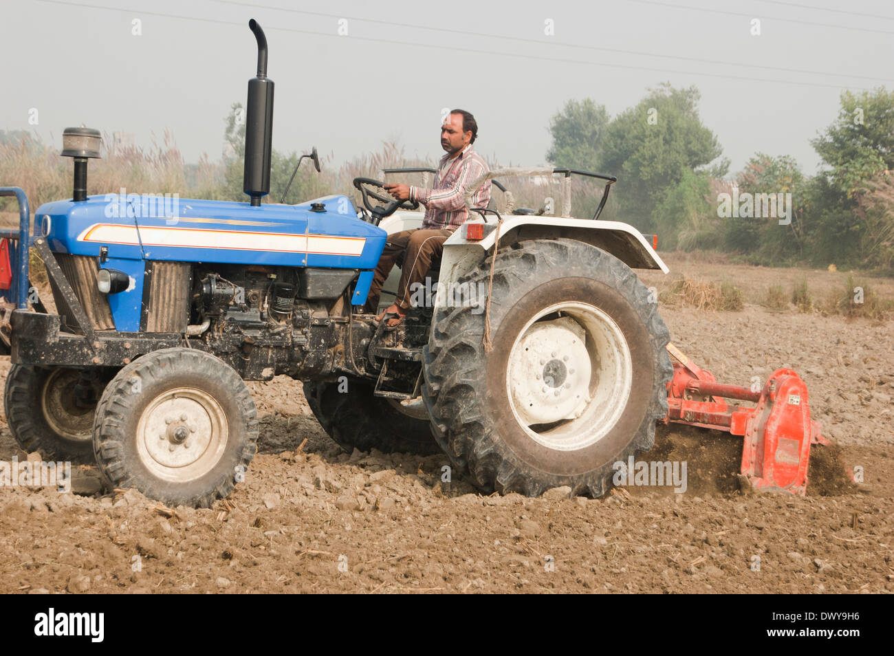 1 Indian Farmer Driving Tractor Stock Photo - Alamy