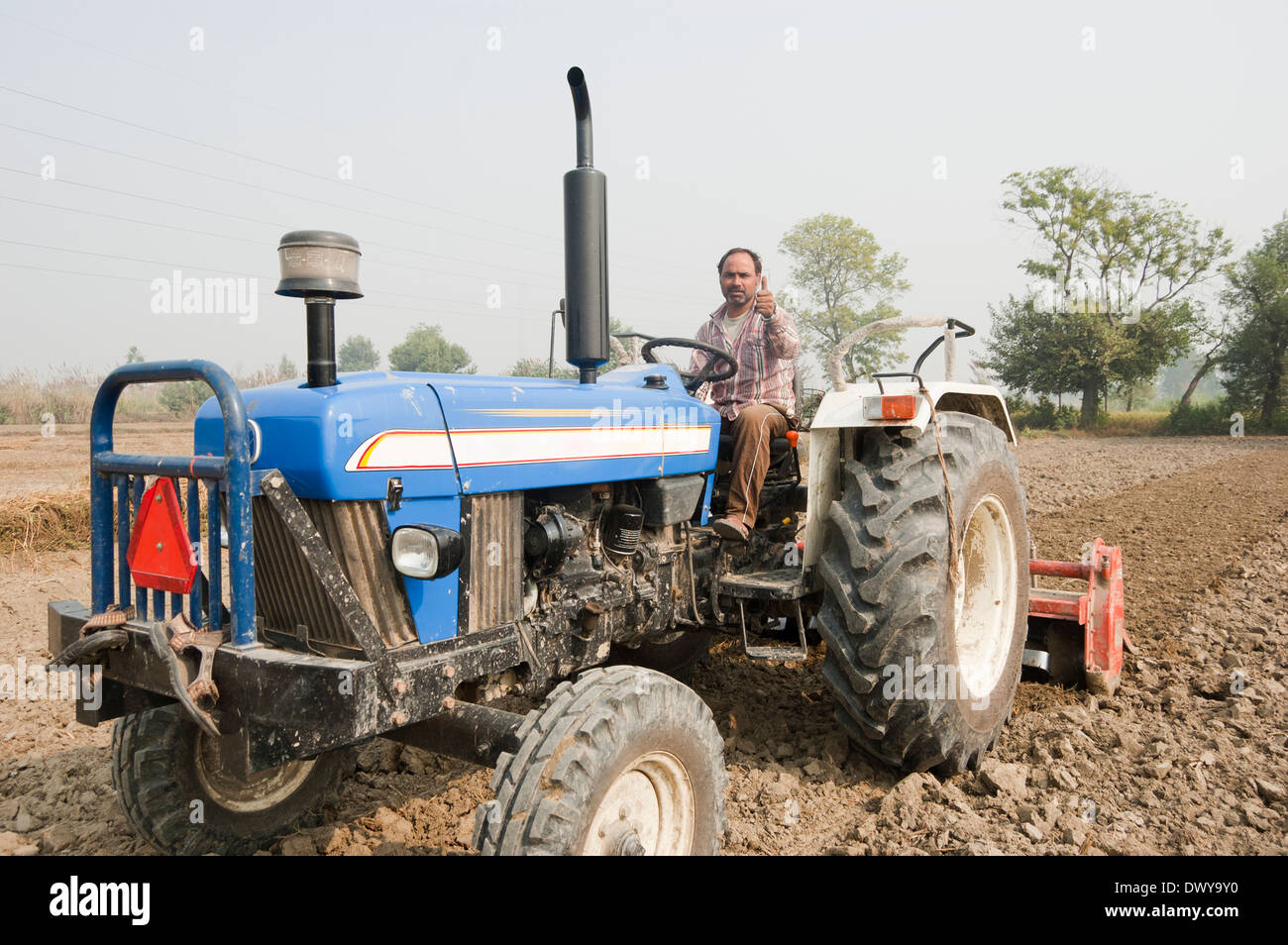 1 Indian Farmer Driving Tractor Stock Photo - Alamy