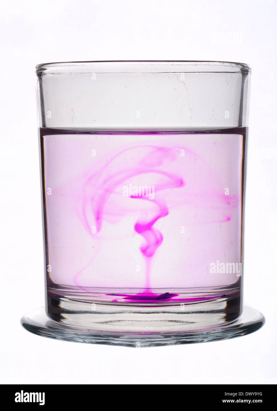 Measuring cup with liquid on white background Stock Photo - Alamy