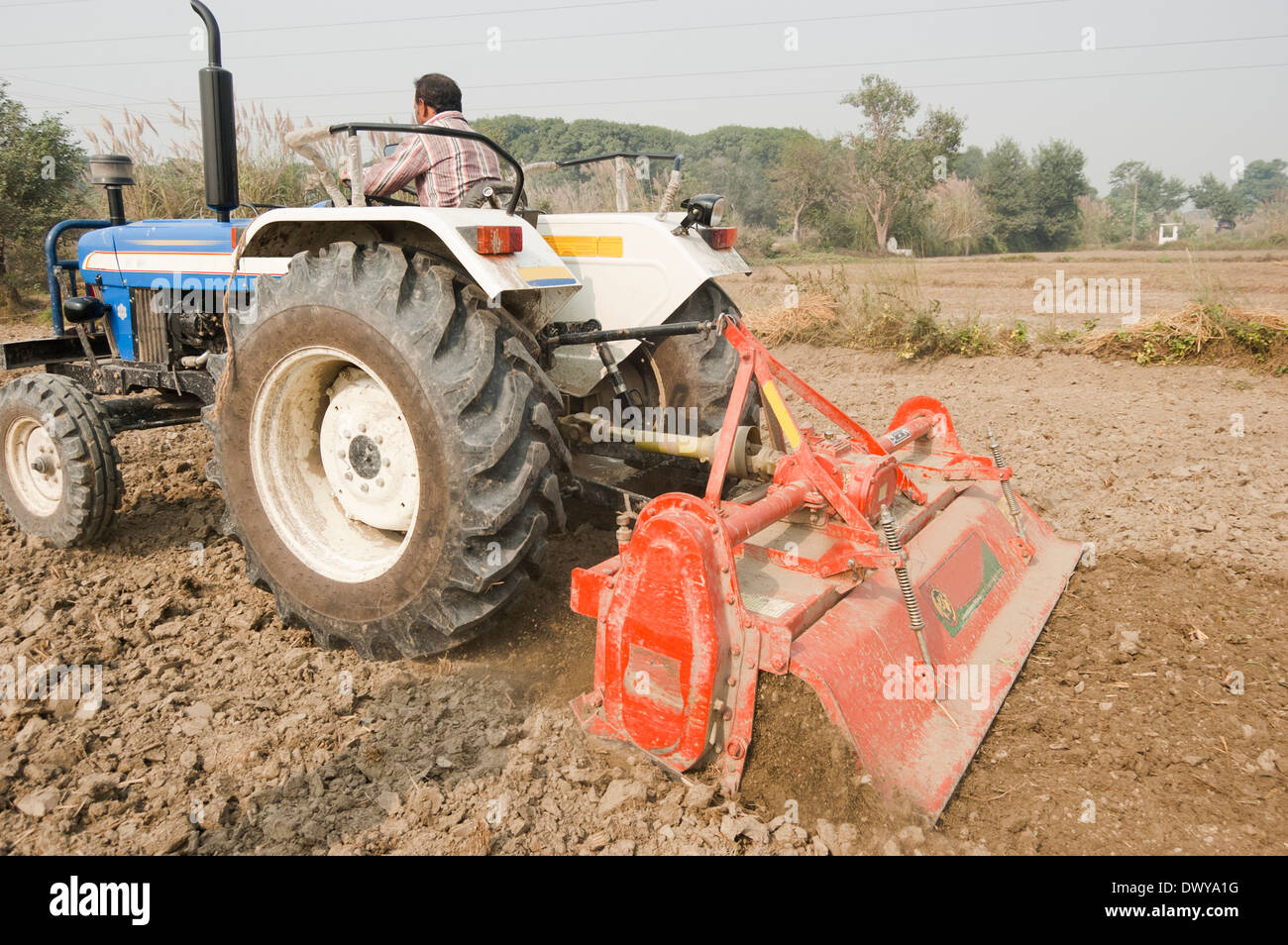 1 Indian Farmer Driving Tractor Stock Photo - Alamy