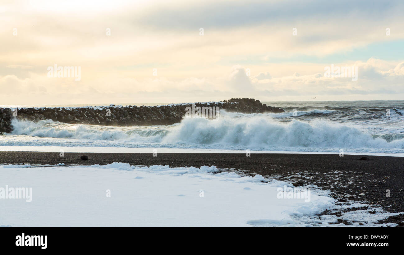 Strong Atlantic Ocean waves crash on the black sand beach at Vík í ...
