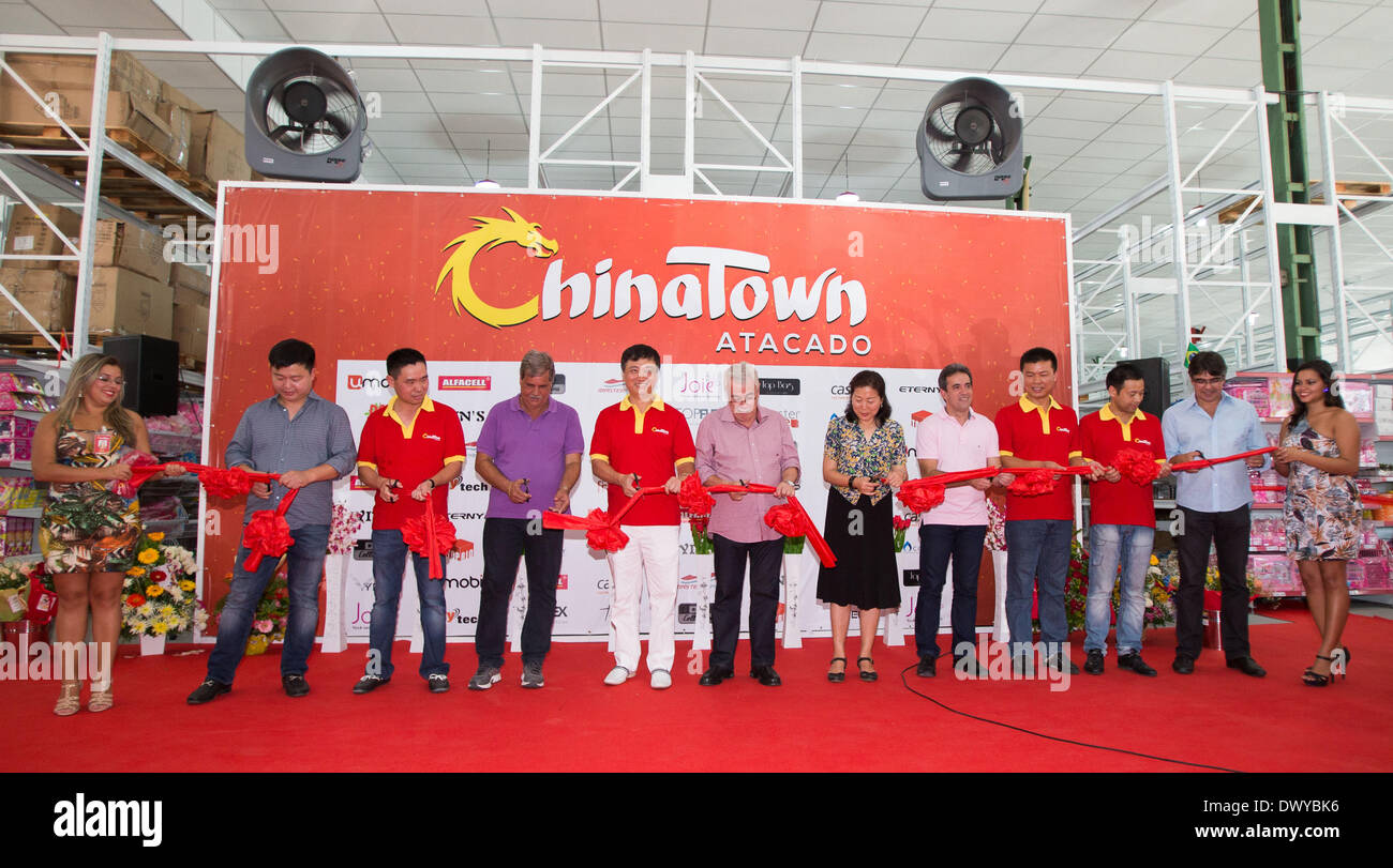 Rio De Janeiro, Brazil. 14th Mar, 2014. Guests cut the ribbon on the ...