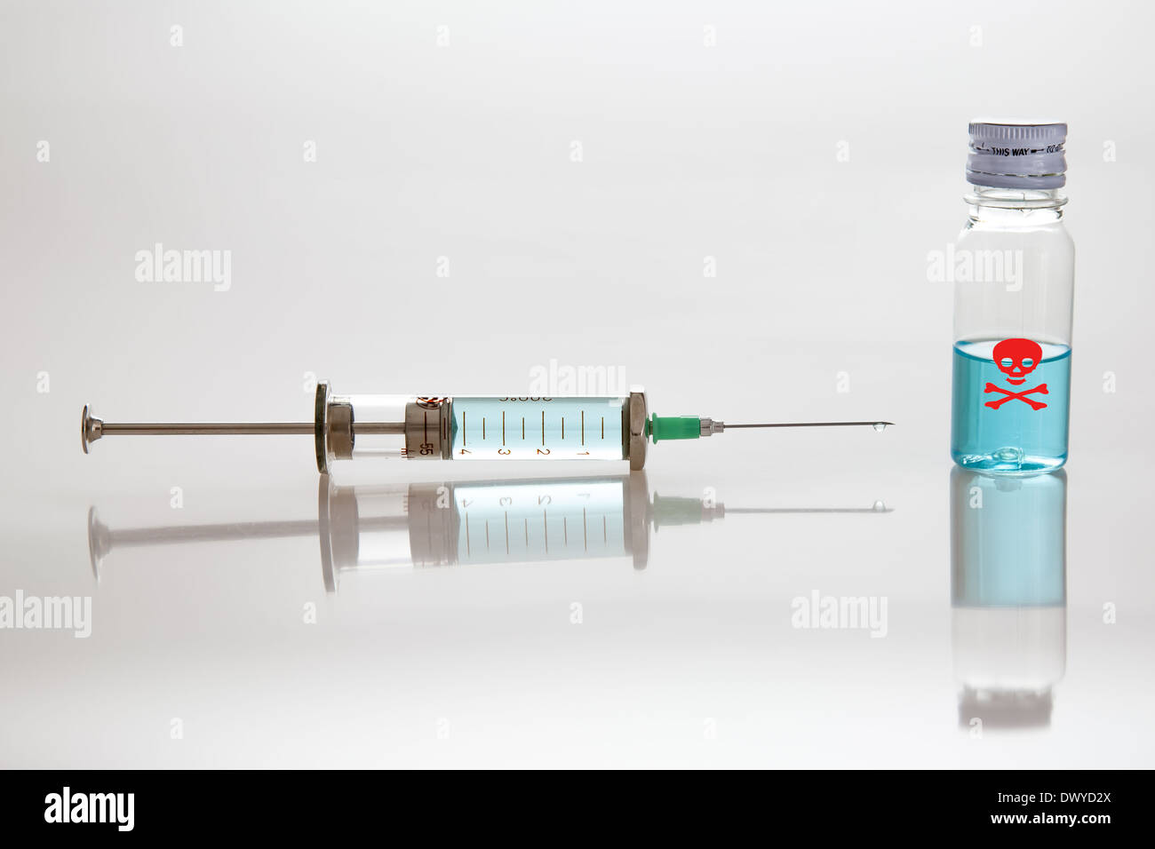 glass syringe with needle and vial with poison Stock Photo - Alamy