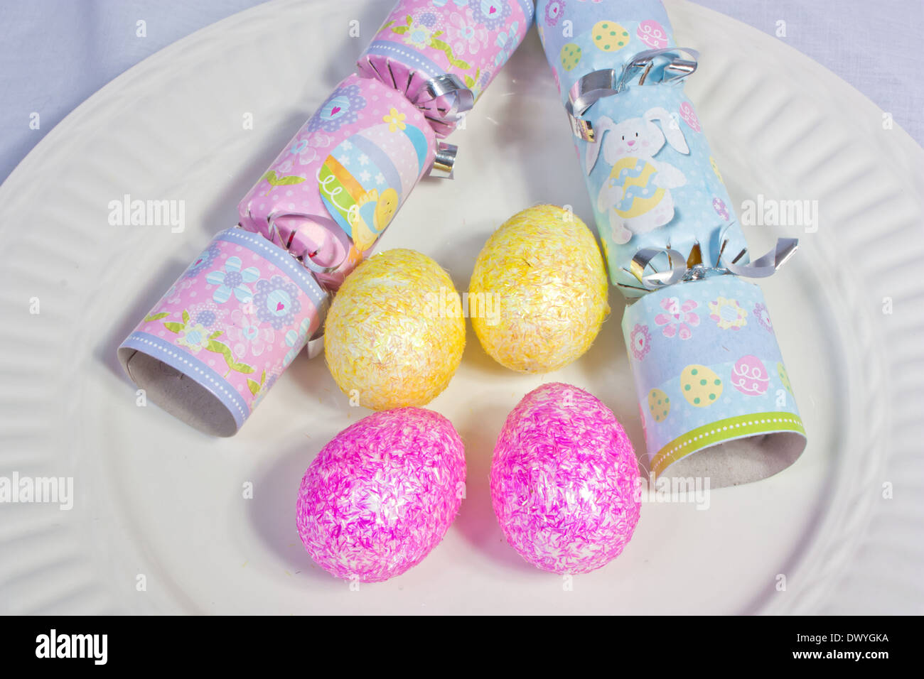 An image showing the concept of Easter with colored eggs and crackers Stock Photo - Alamy