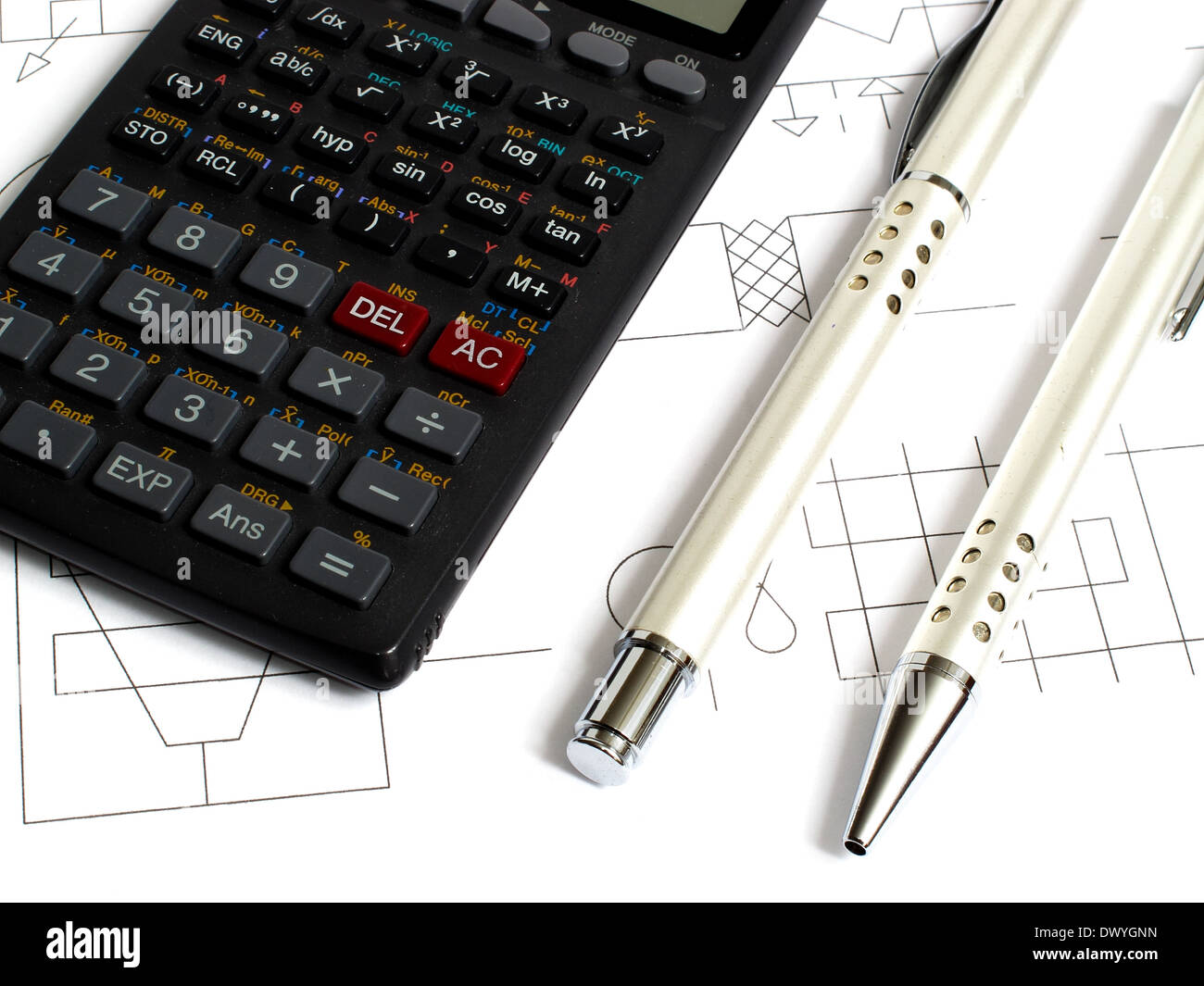 An image showing a calculator and pens used for working out problems ...
