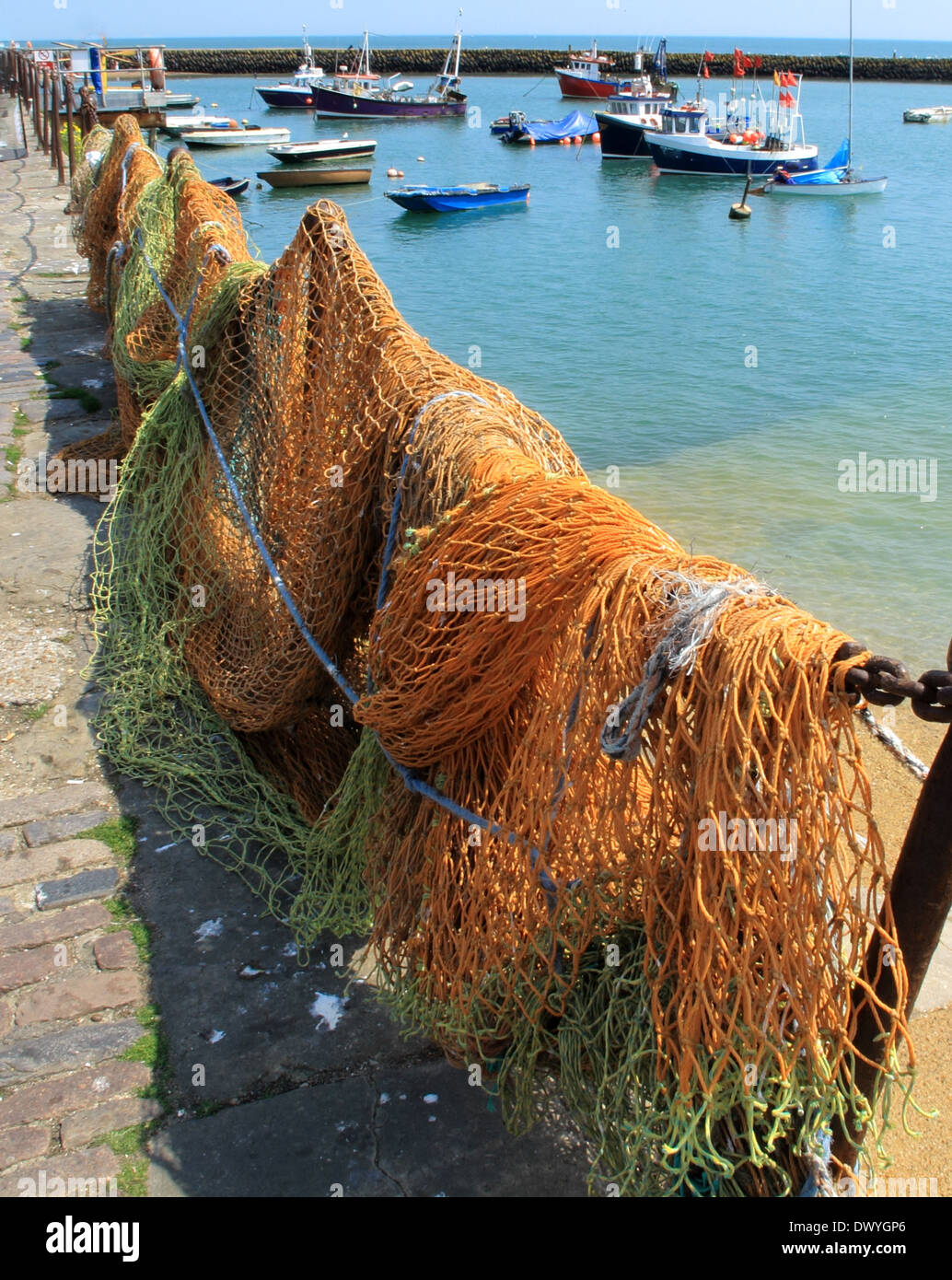 An image showing the fishing nets and boats around the harbour Stock ...