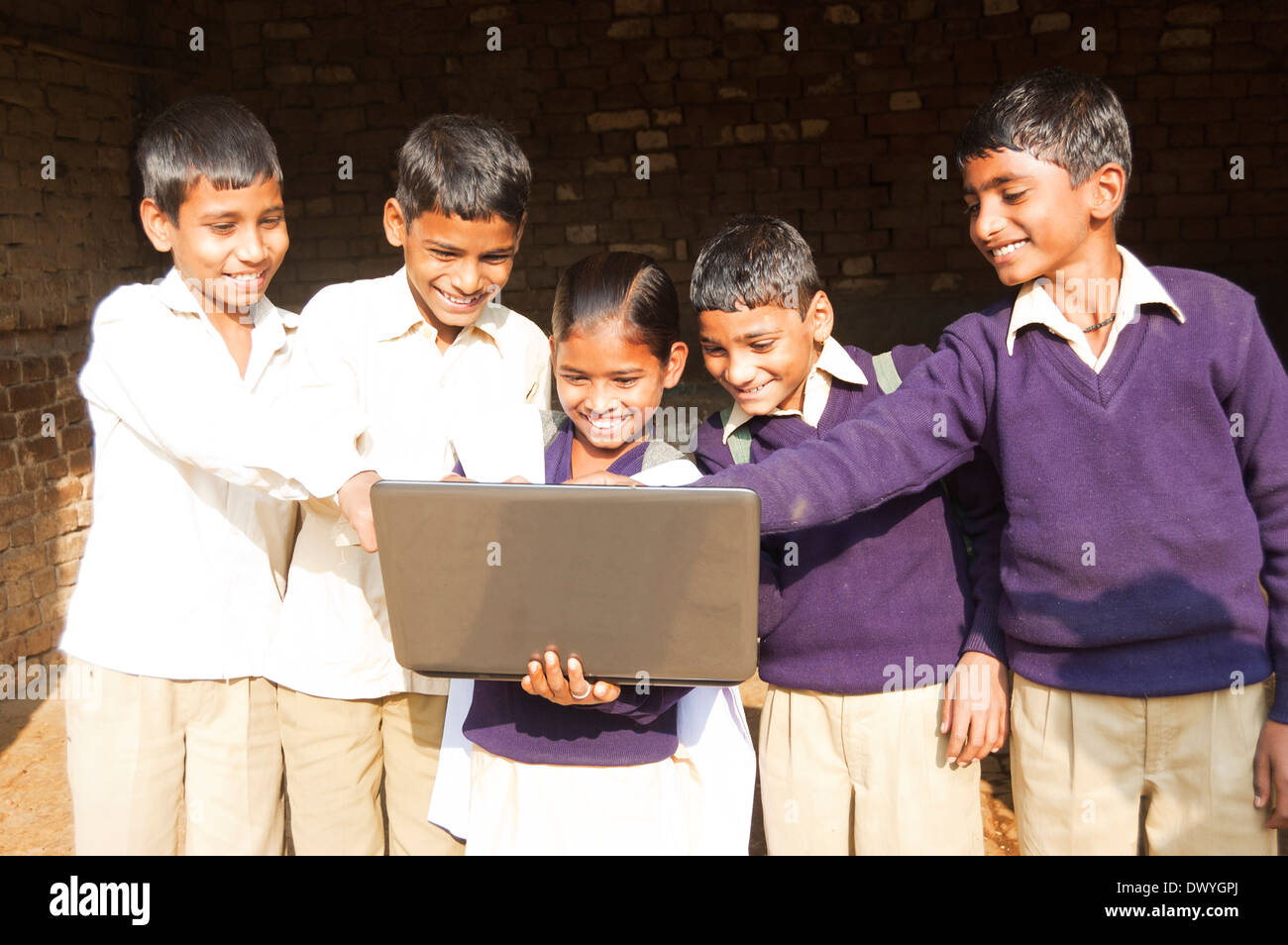 Indian Kids Standing with Laptop Stock Photo - Alamy