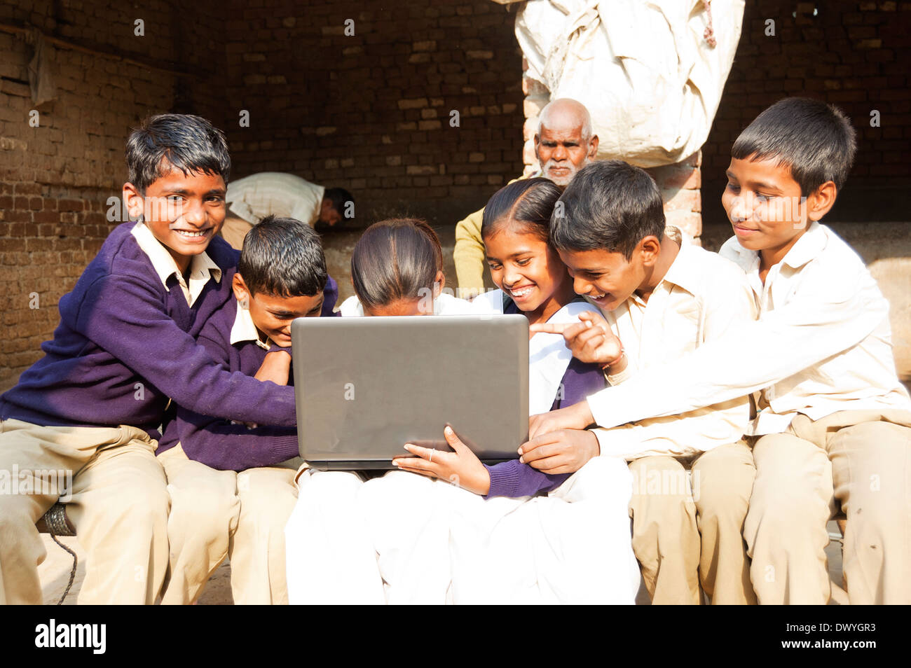 Boy girl laptop pointing smiling hi-res stock photography and images ...