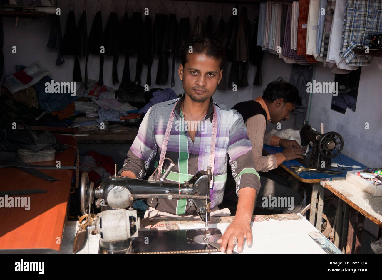 1 Indian Man Stitches clothes Stock Photo - Alamy