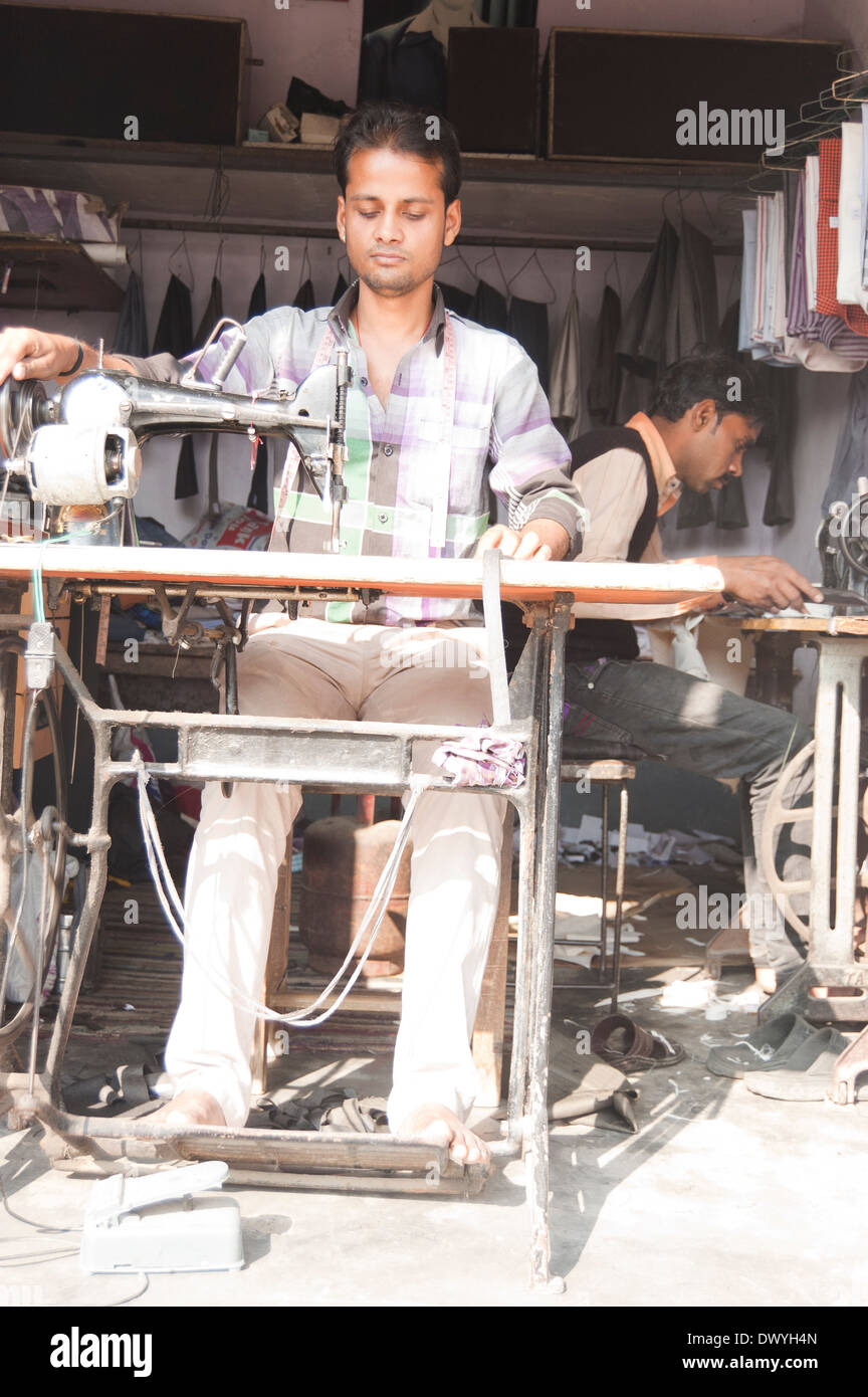 1 Indian Man Stitches clothes Stock Photo - Alamy