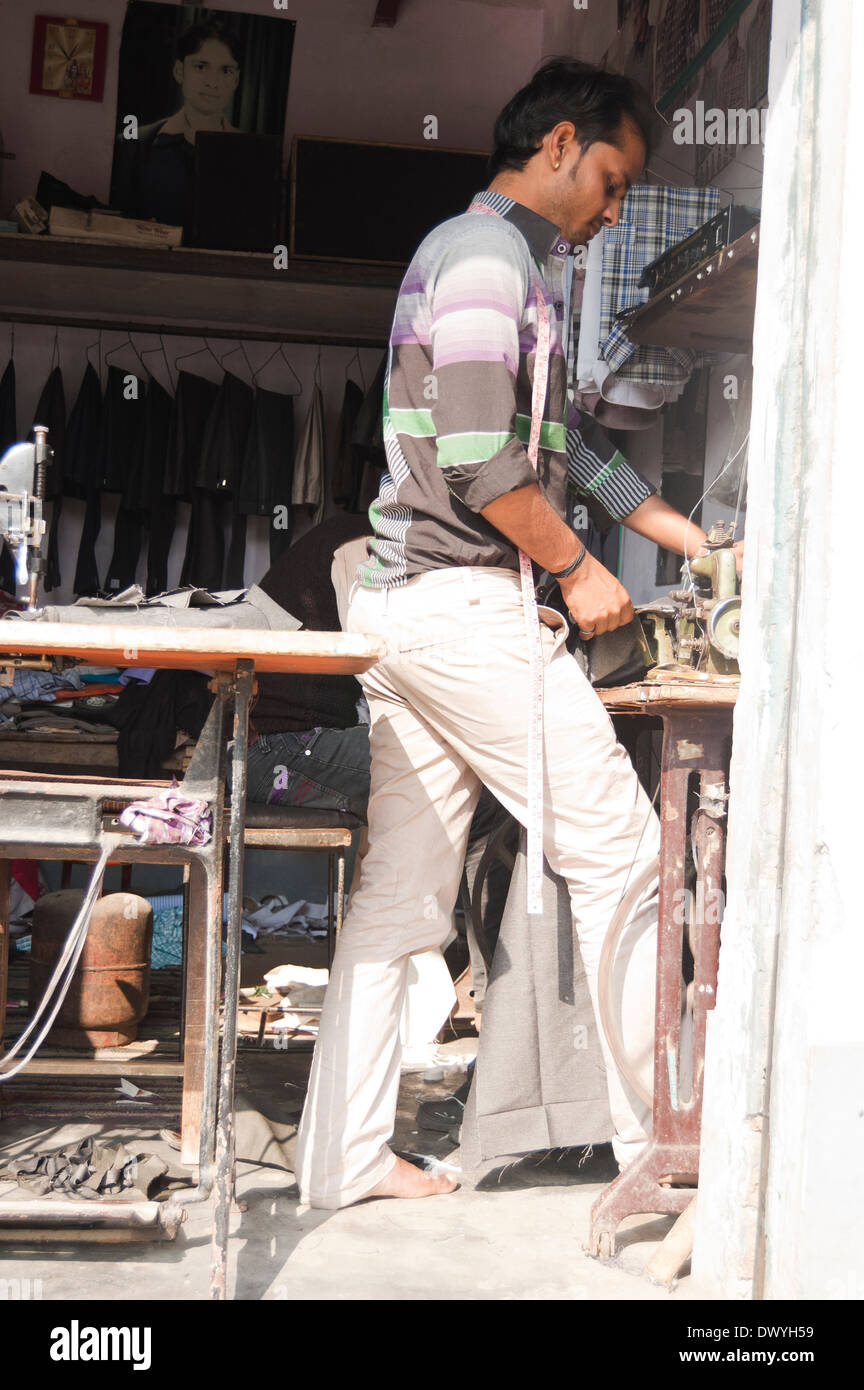 Indian Man Stitches clothes Stock Photo - Alamy