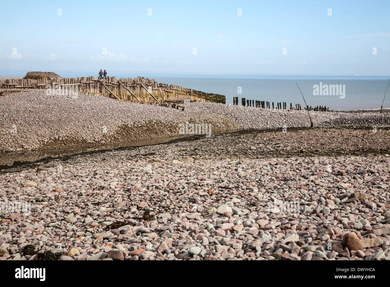 Pebble beach and harbour entrance at low tide, Porlock Weir, Somerset ...