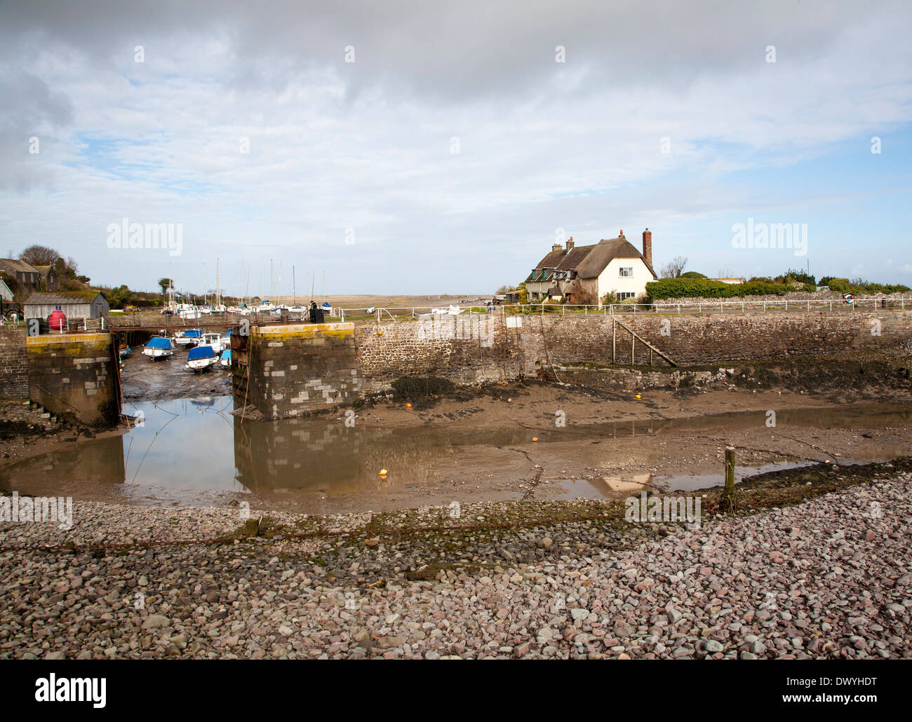 Pebble beach and harbour entrance at low tide, Porlock Weir, Somerset ...