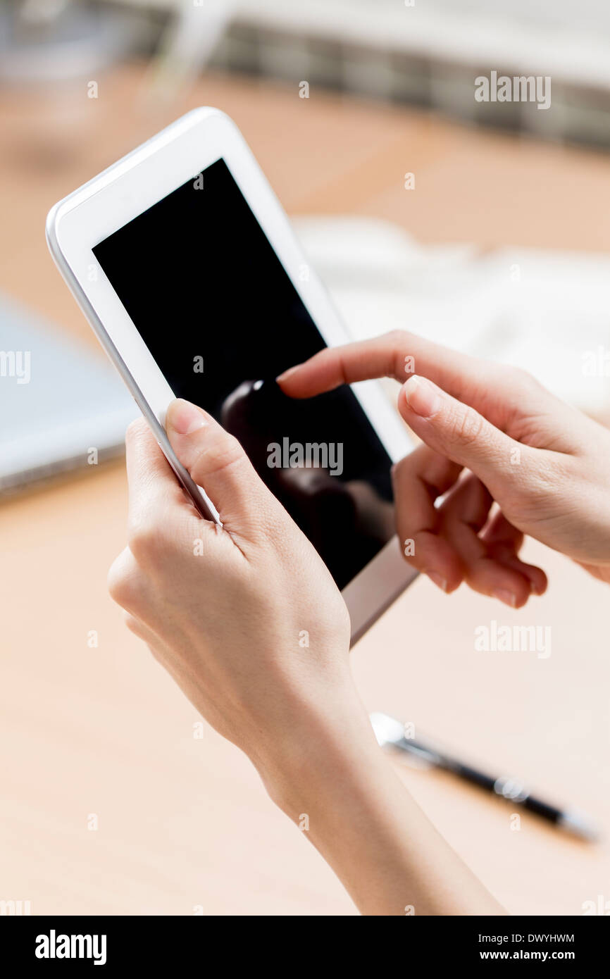 Woman working on a tablet Stock Photo - Alamy