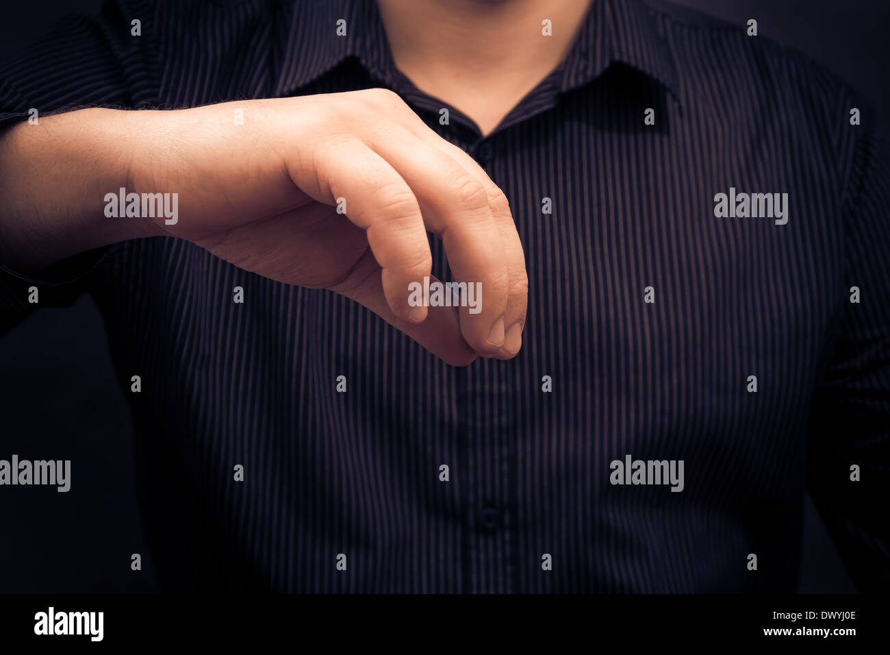 Hand of a man holding some gadget or something disgusting Stock Photo ...