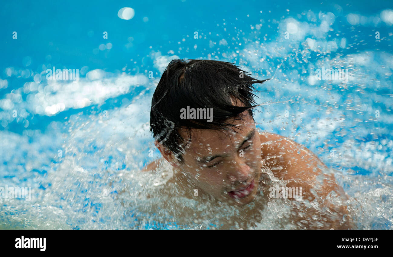 Beijing, China. 15th Mar, 2014. He Chong of China gets out from the ...