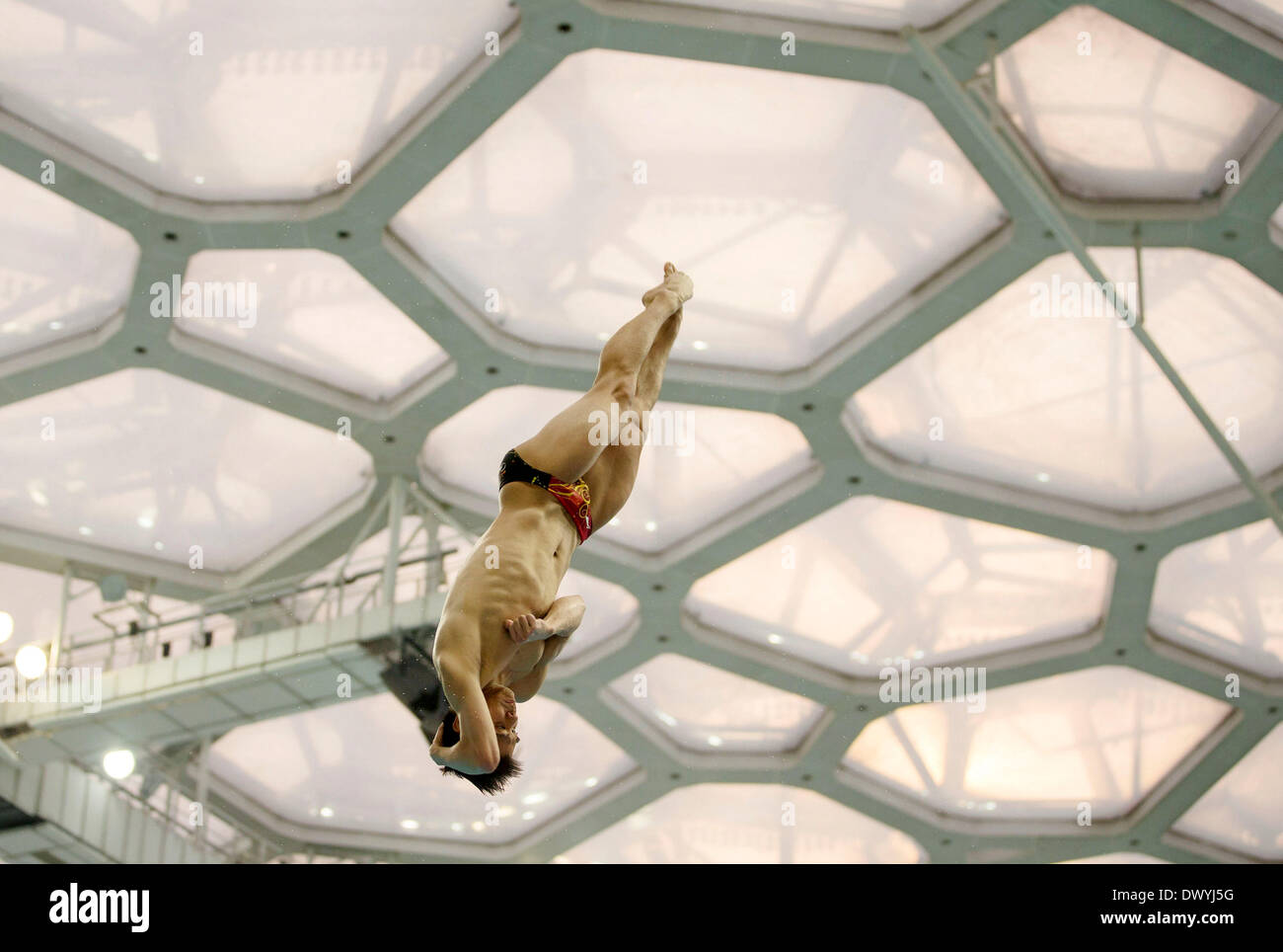 Beijing, China. 15th Mar, 2014. He Chong of China competes during the ...