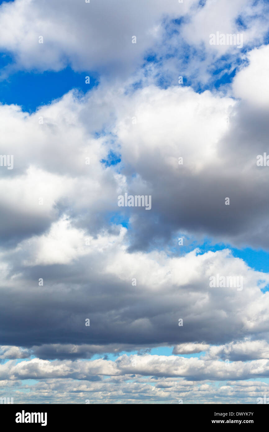 heavy woolpack clouds in blue spring sky Stock Photo - Alamy
