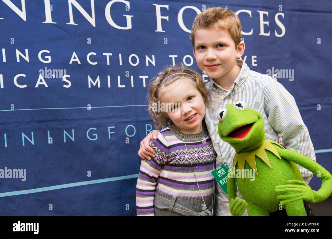 Military children pose with Kermit the Frog during a movie screening of ...