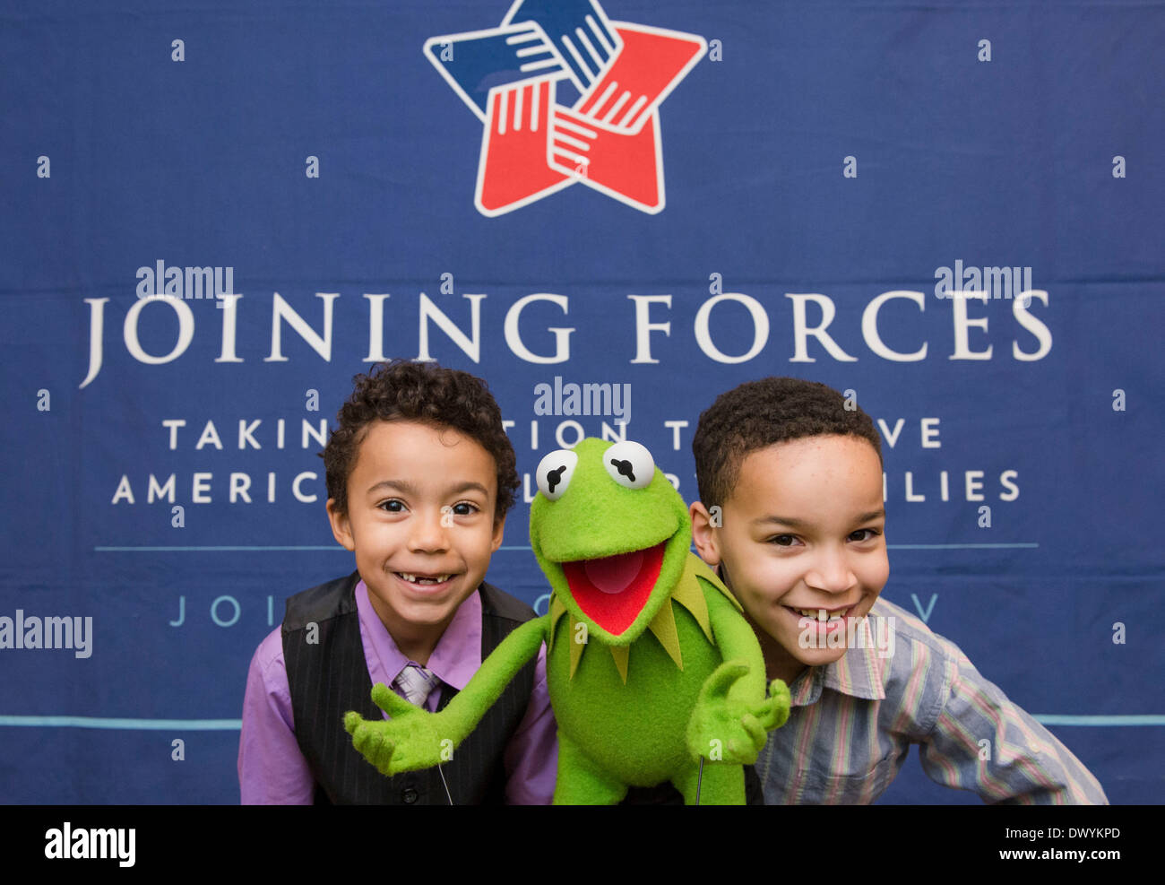 Children of military families pose with Kermit the Frog during a movie ...