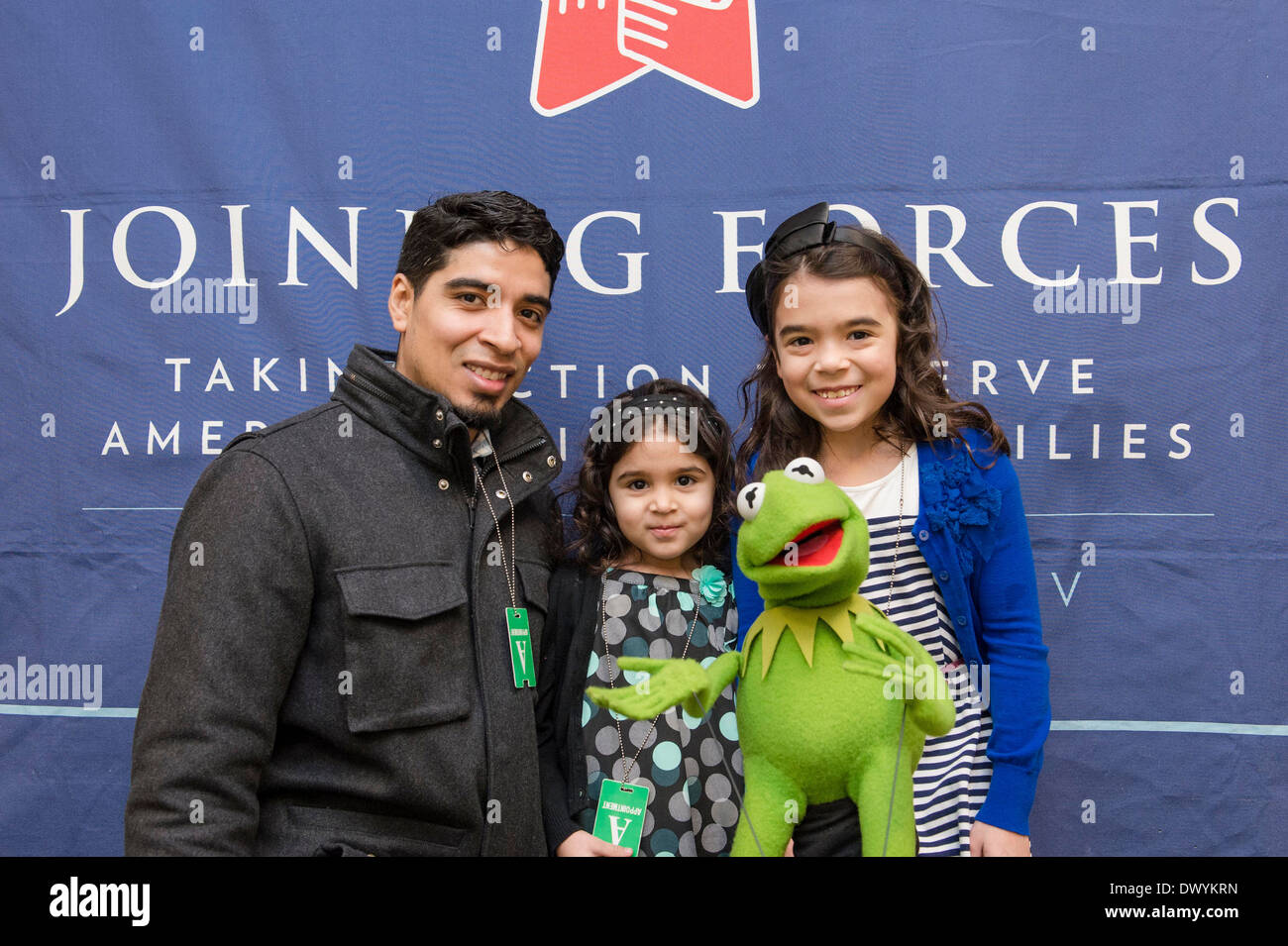 Military families pose with Kermit the Frog during a movie screening of ...