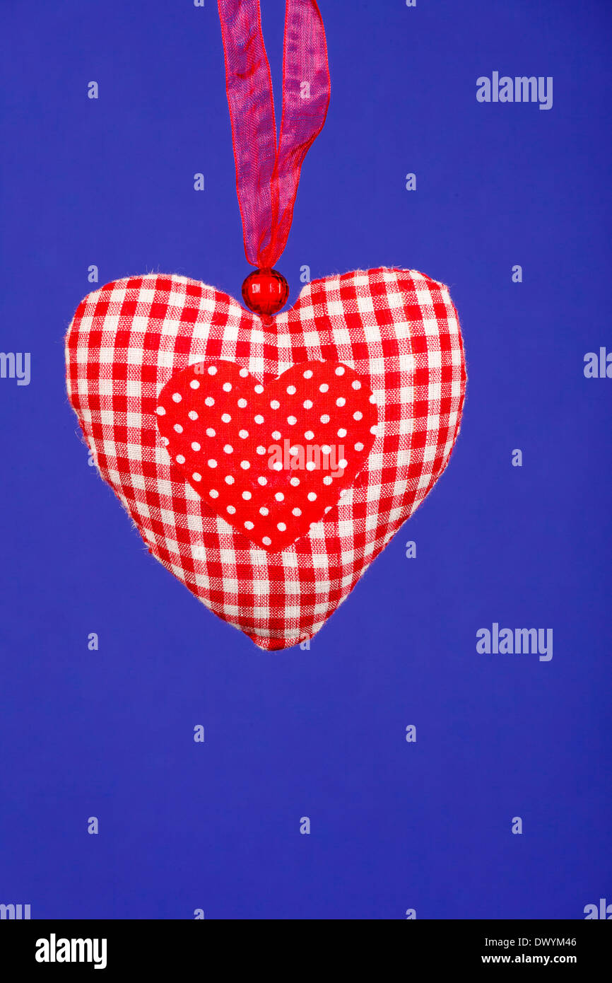 Heart lining on blue background Stock Photo - Alamy