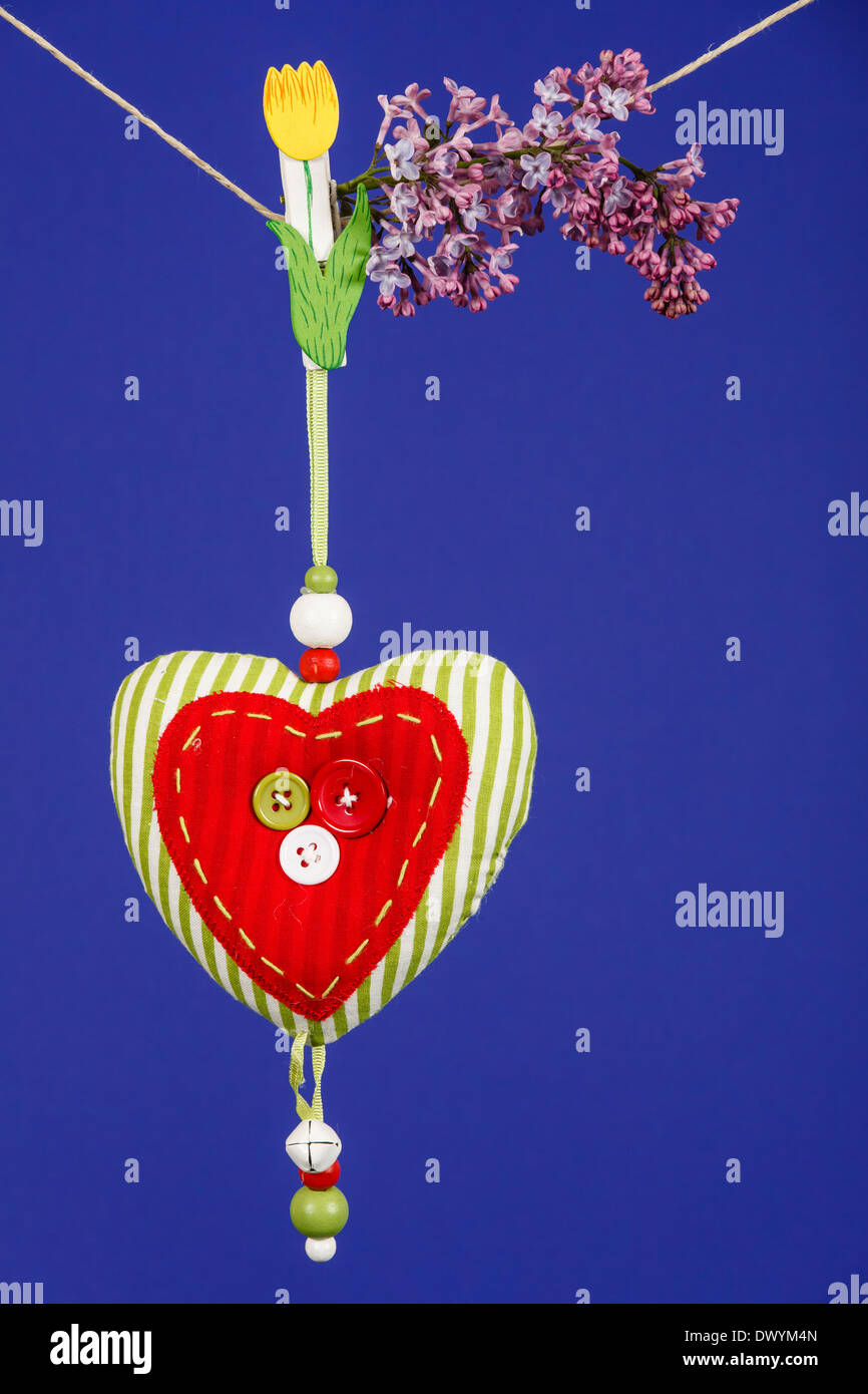 Heart lining on a blue background, with lilac Stock Photo - Alamy