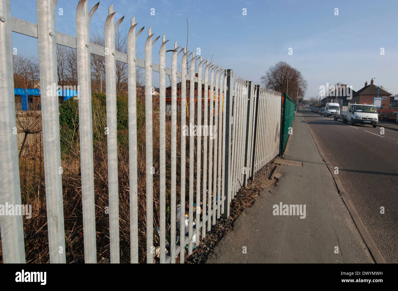 A Public Pavement, Metal Railing Are On One Side,& A Busy Main Road Is ...