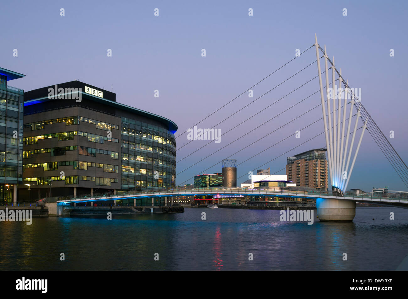 The MediaCityUK swing footbridge at dusk, over the Manchester Ship ...